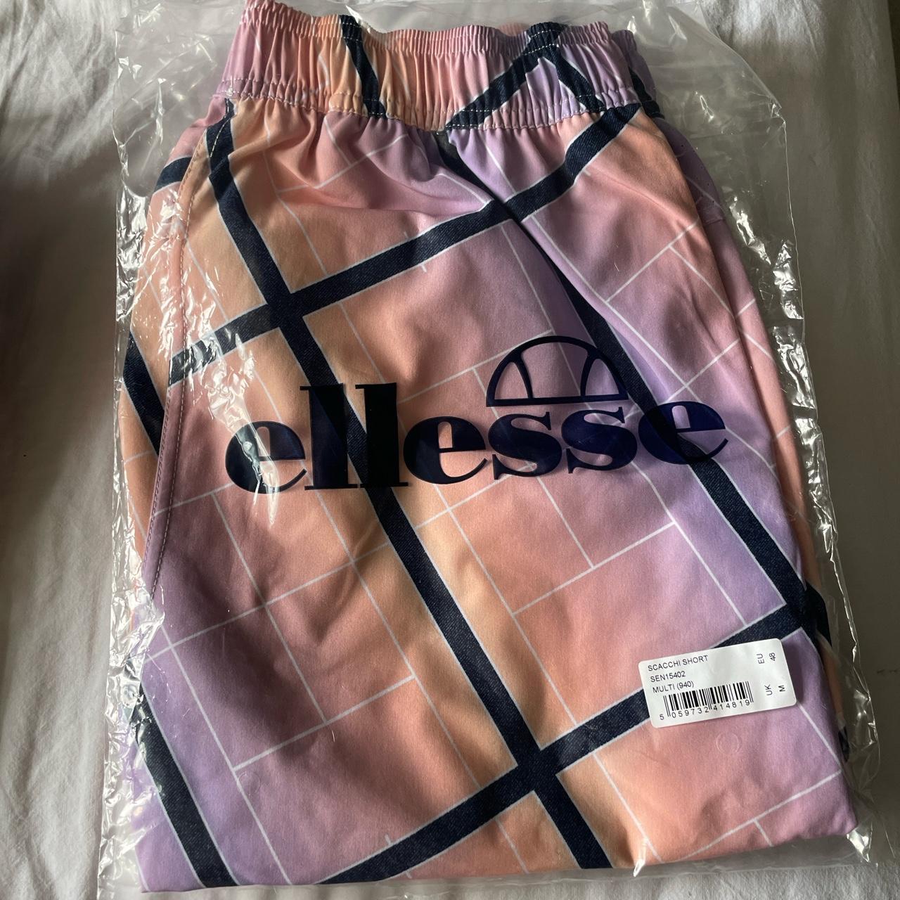 Brand new Ellesse purple/orange sports tennis shorts... - Depop