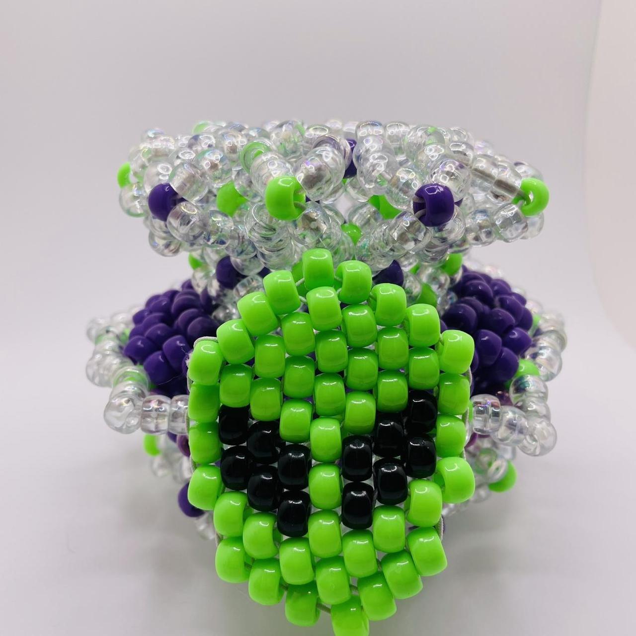 Green and purple rotating UFO alien head Kandi cuff... | Depop