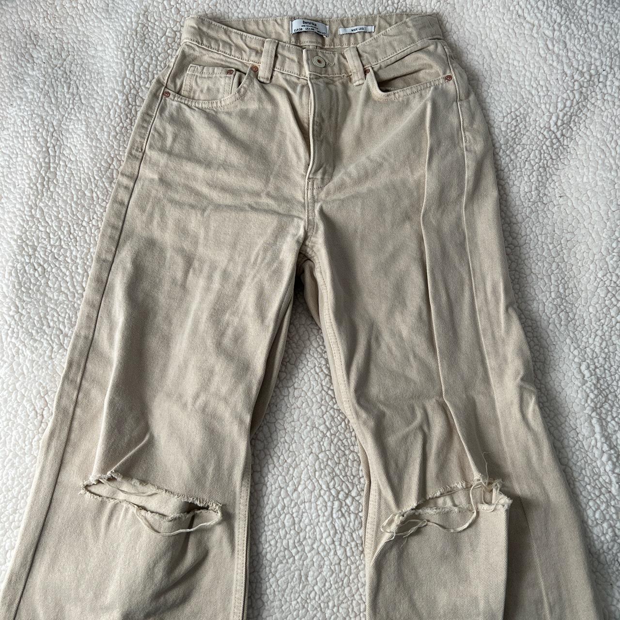 Bershka women’s khaki jeans. Ripped at knee. Flare... - Depop