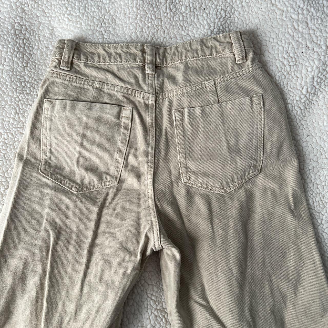 Bershka women’s khaki jeans. Ripped at knee. Flare... - Depop