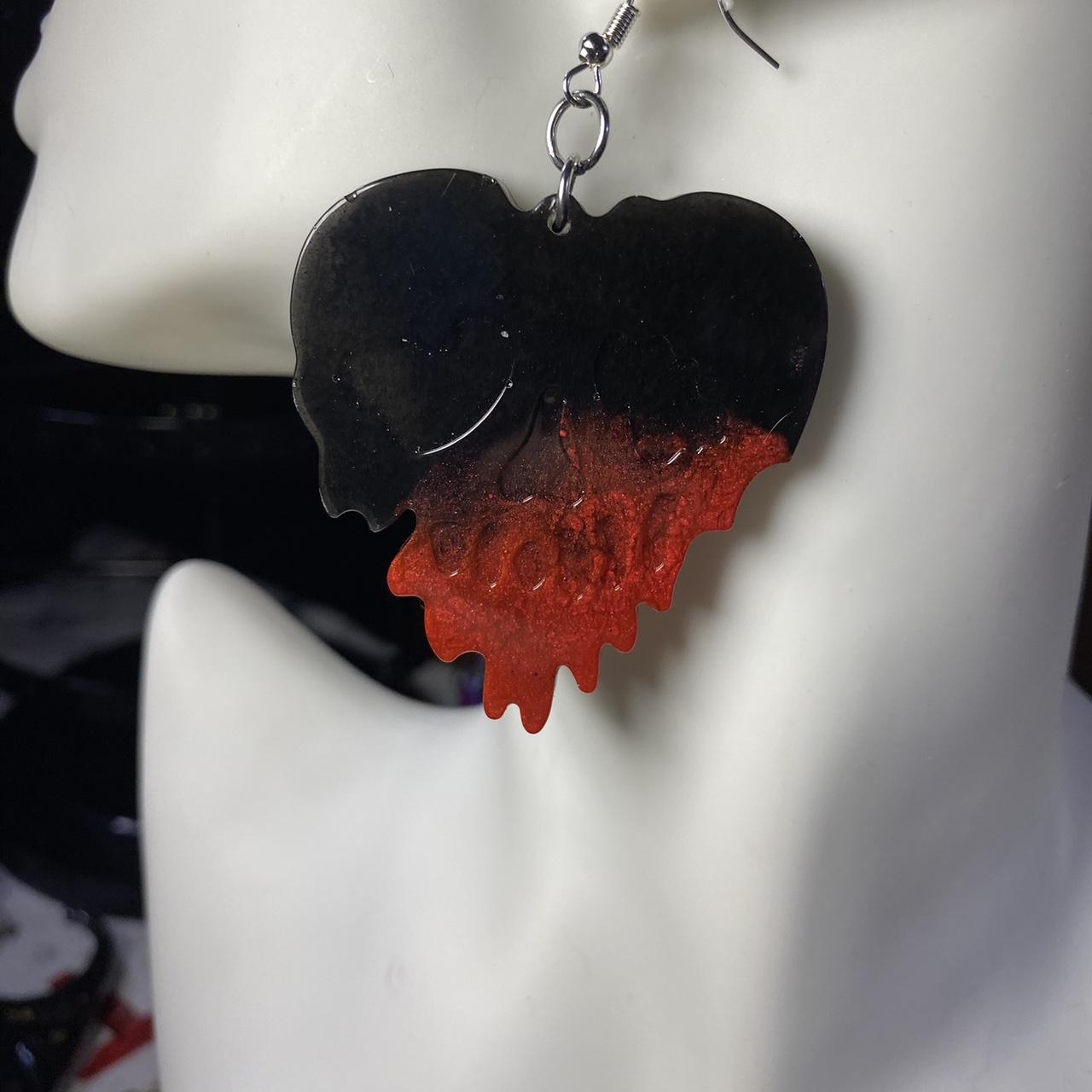 Handmade resin black and red drippy heart earrings... | Depop