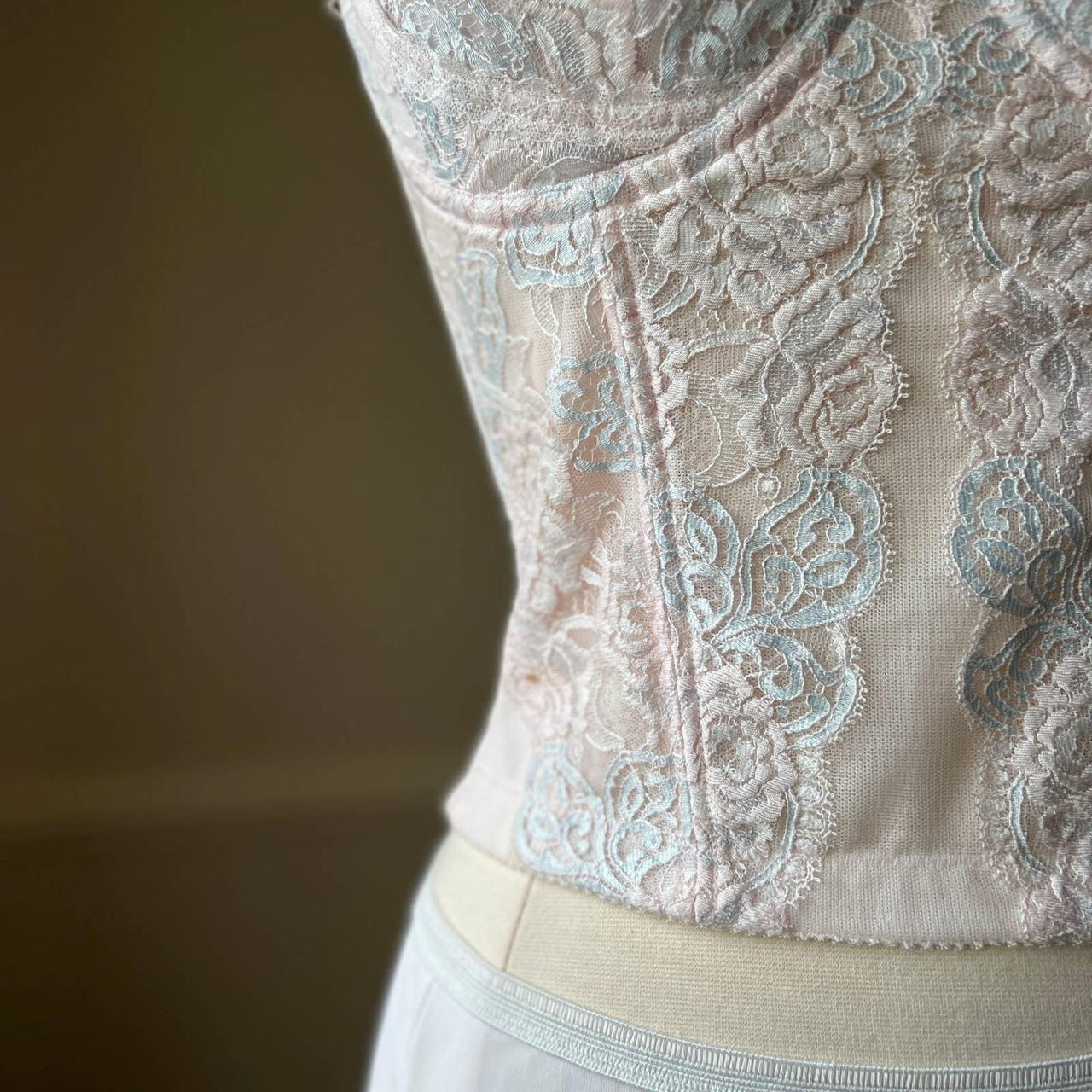 Vintage-inspired pastel corset featuring rosette... - Depop