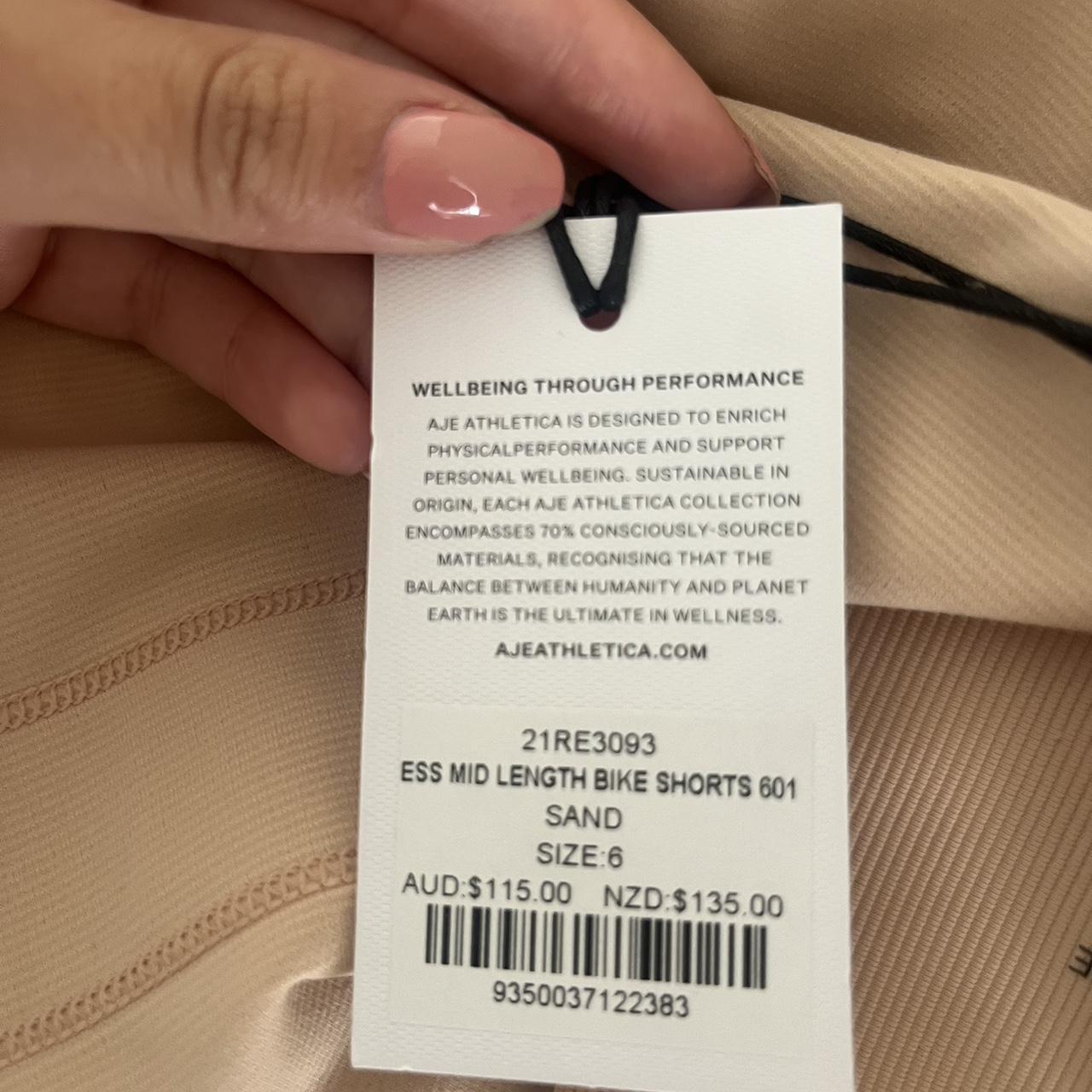 Aje athletics ess mid length bike short sand- brand... - Depop