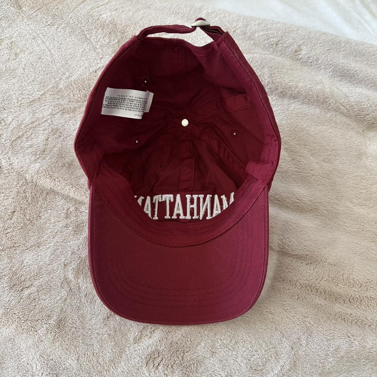 Red/ maroon/ burgundy baseball cap with ‘Manhattan’... | Depop