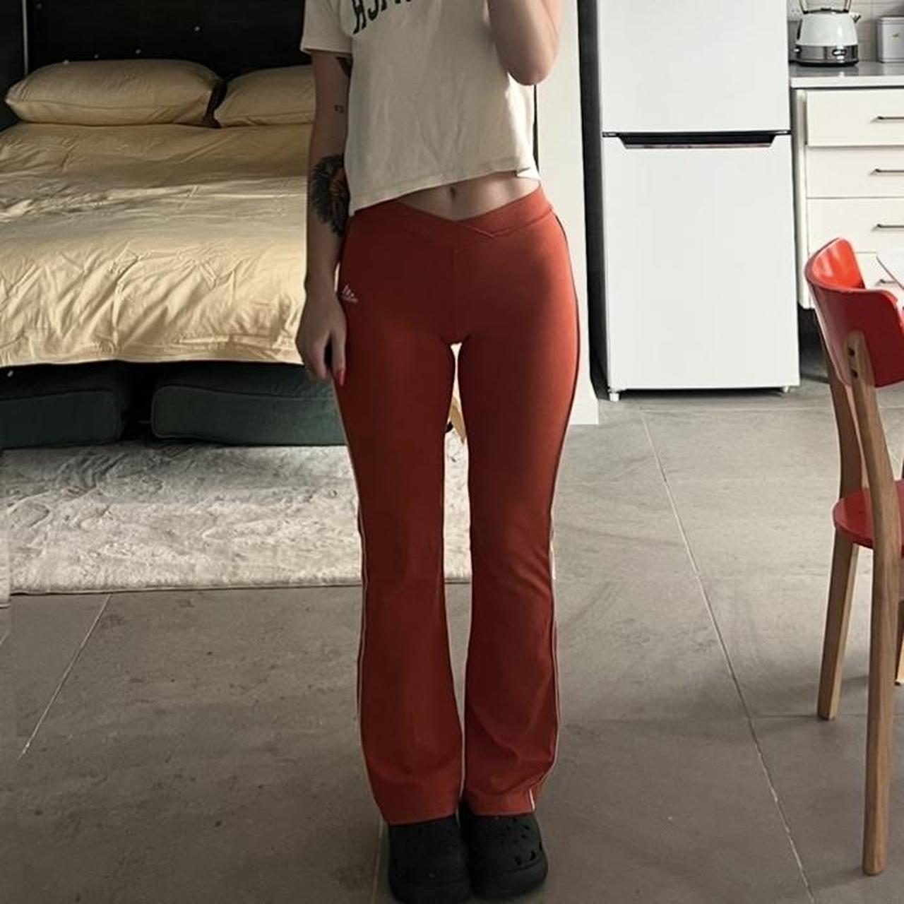 Orange Adidas low-rise flare leggings Made in... | Depop