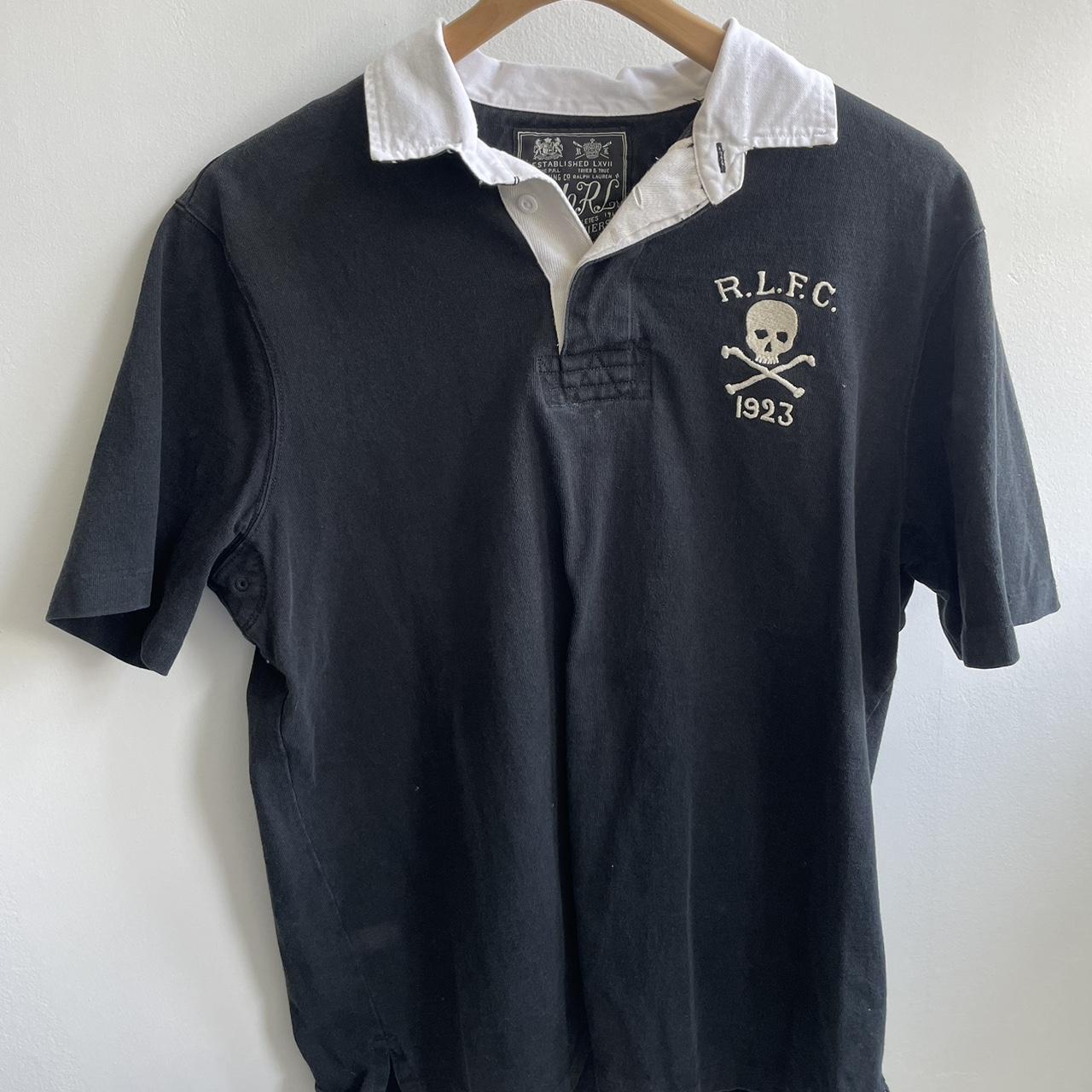 black polo top with skull and bones design. men’s... - Depop