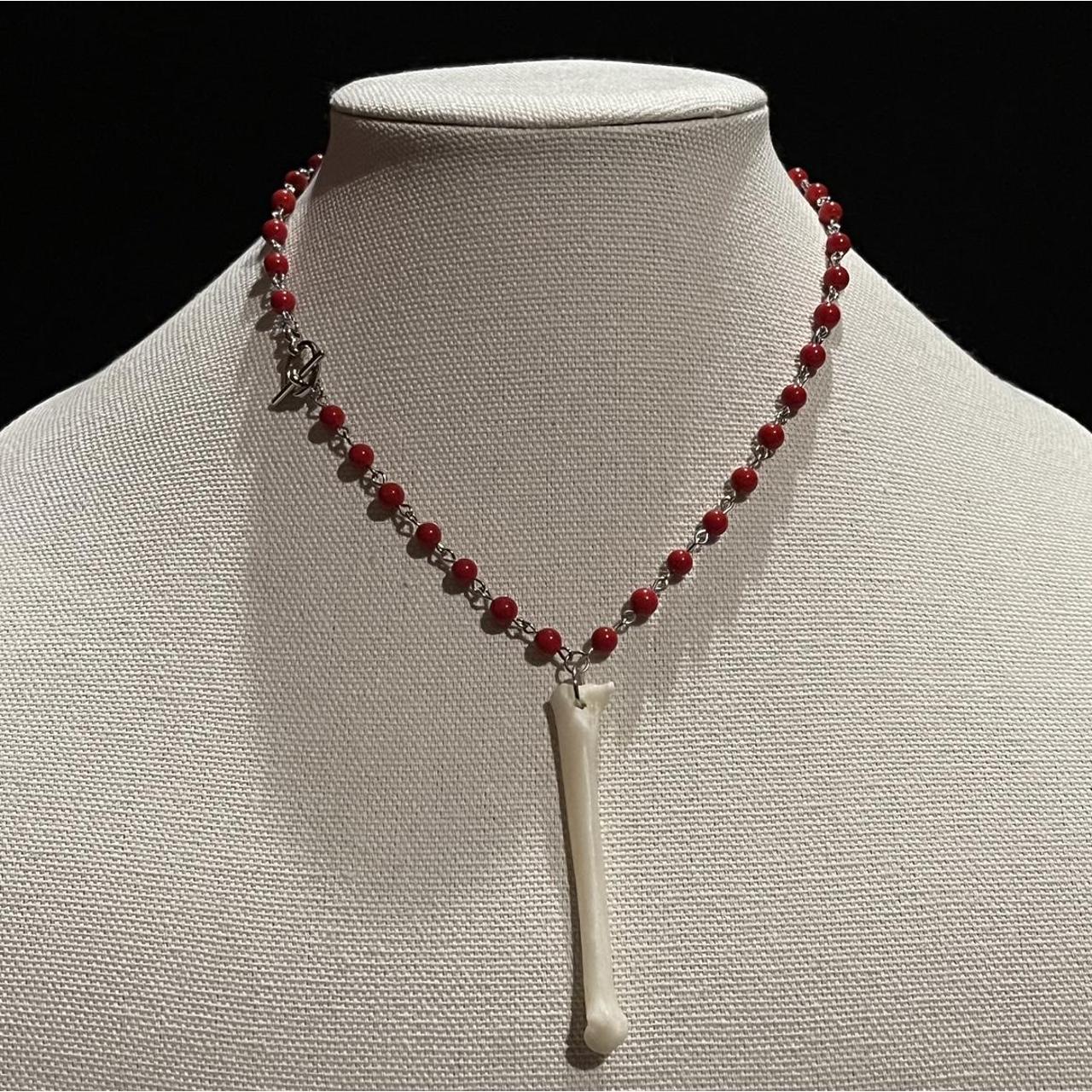 Red Coyote Toe Bone Necklace beads are glass, has... - Depop