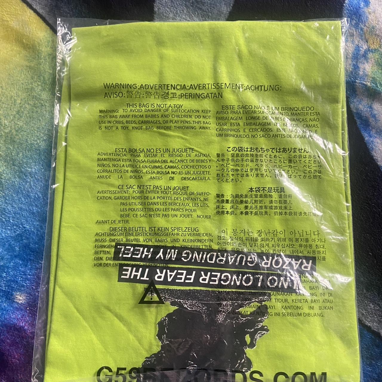 G59 Guarding My Heel Safety Green Tee Size... - Depop