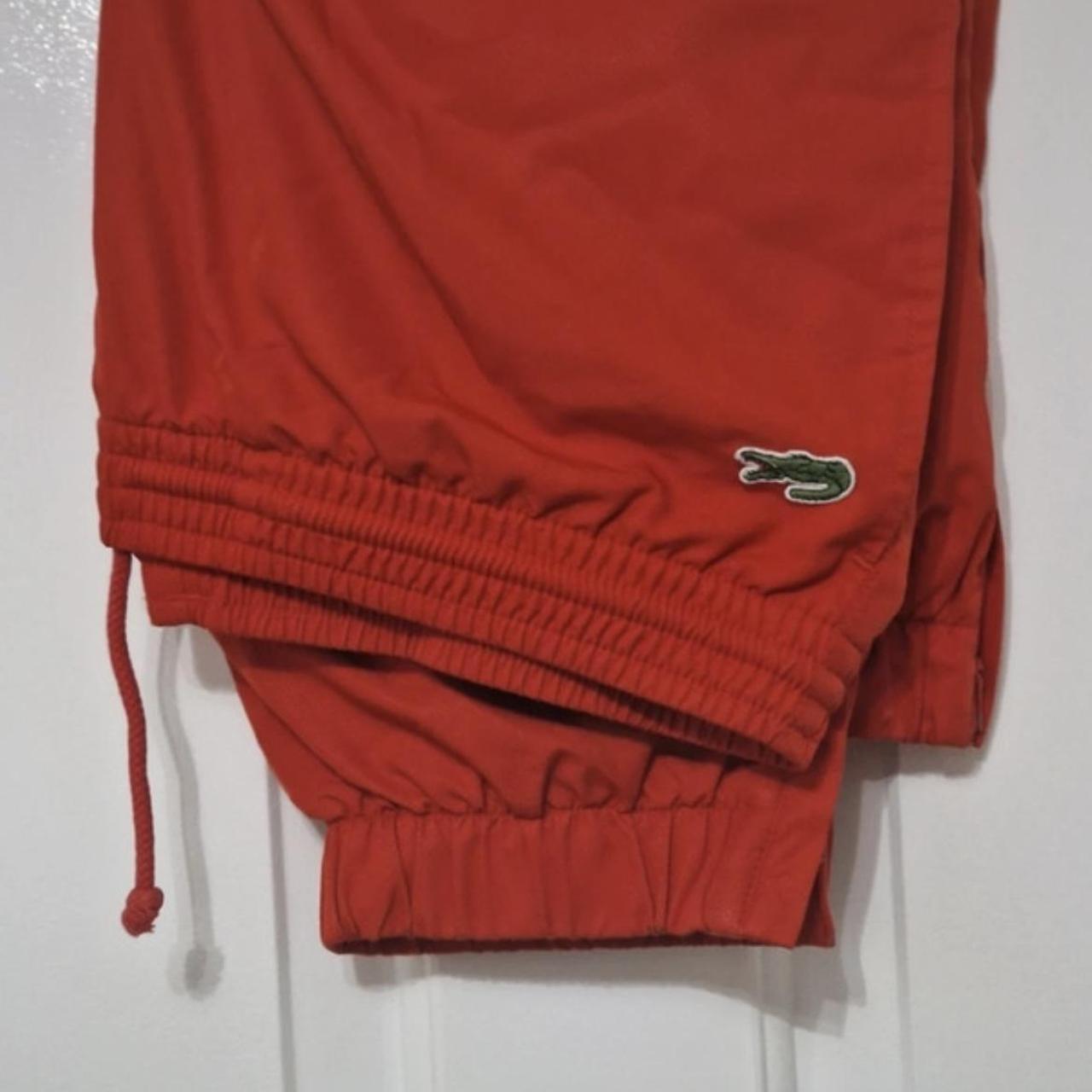 Lacoste tracksuit bottoms old badge in red hard to... - Depop