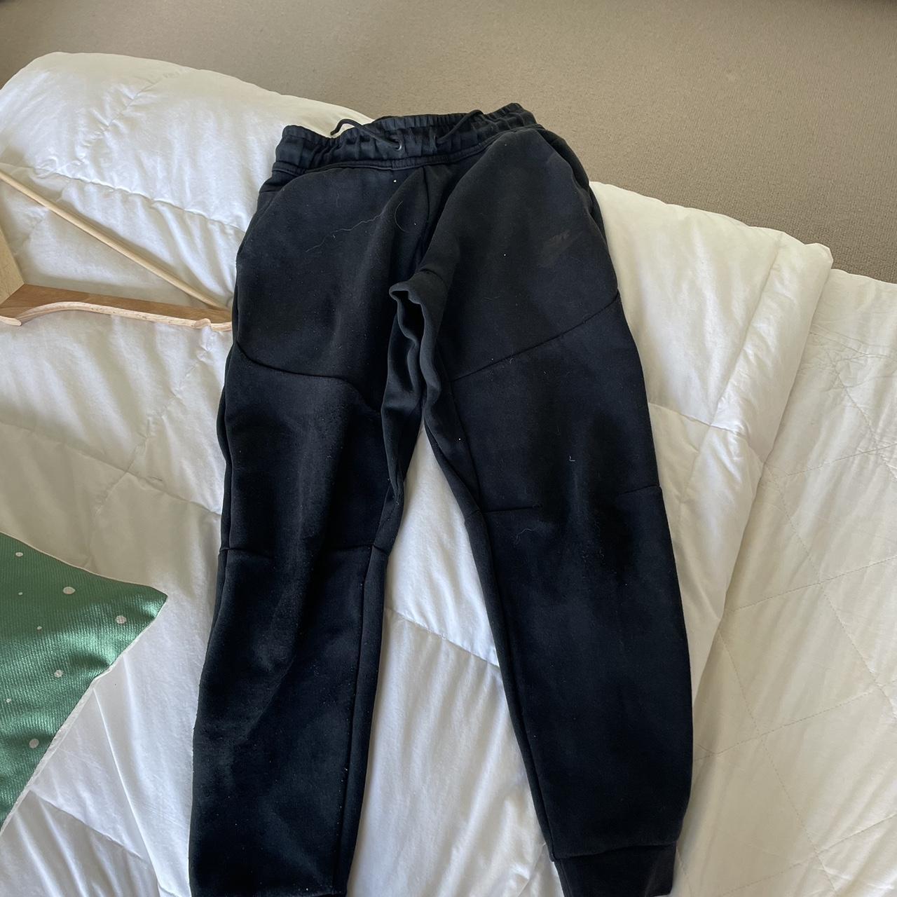 Black Nike tech fleece trousers size medium kids - Depop