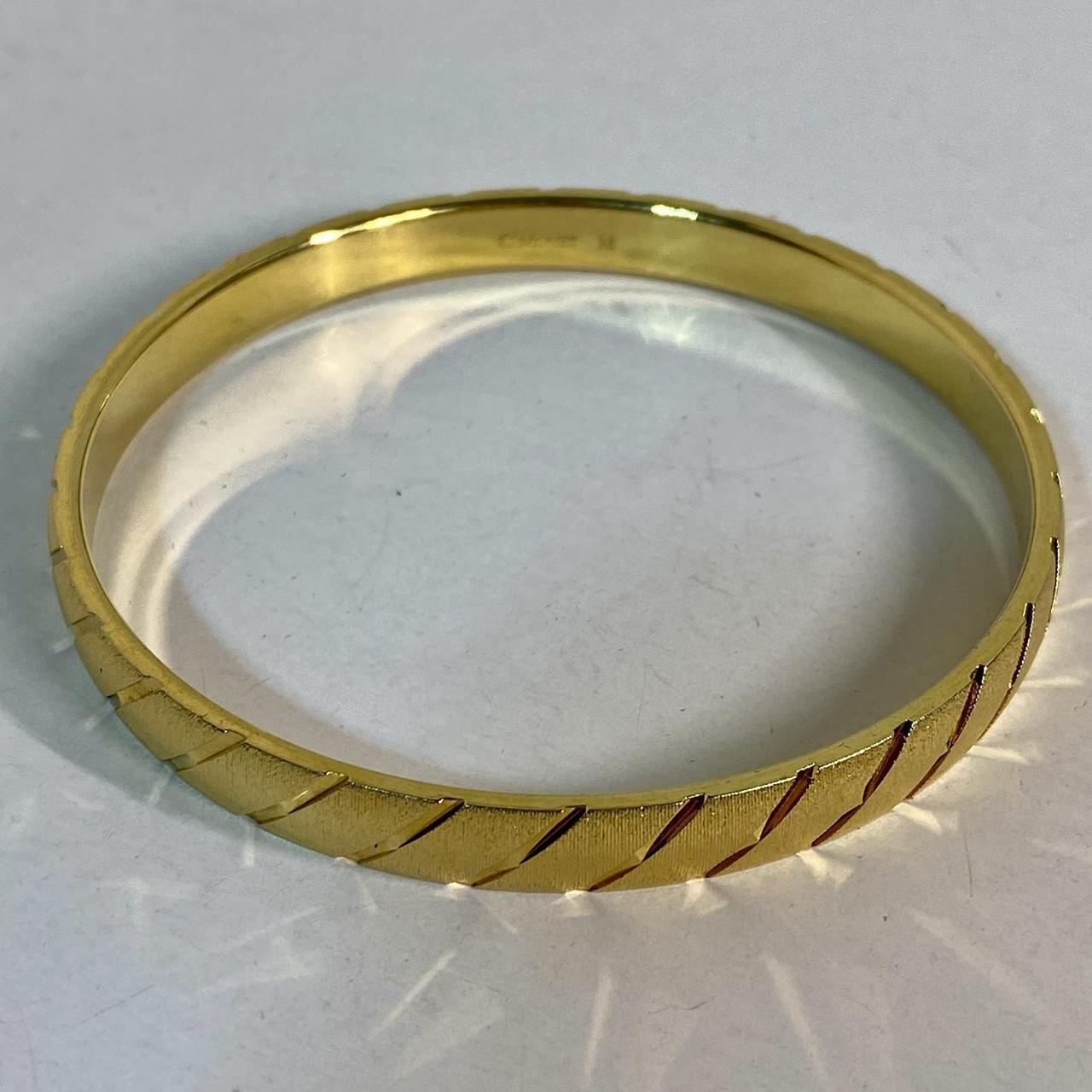 Monet Gold tone bangle bracelet with a touch of... | Depop