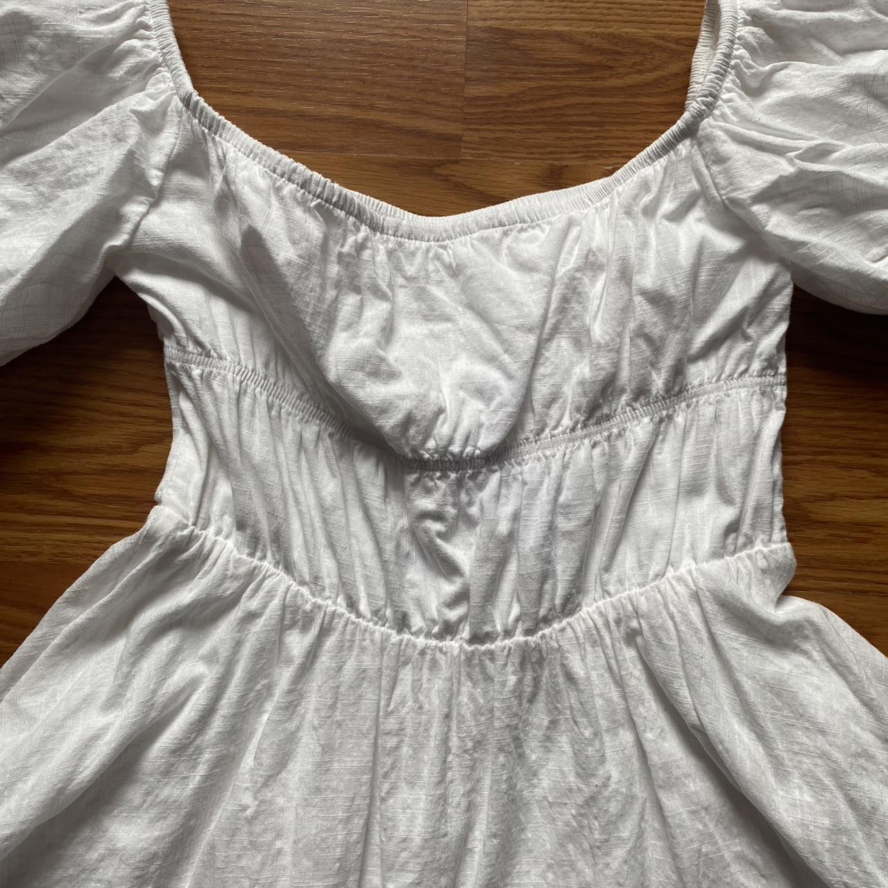 Cute white mini length dress with stretchy cinched... - Depop