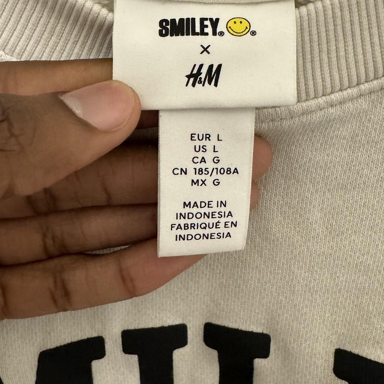 Large Smiley & H&M Cream Sweater Sleeves slight... - Depop