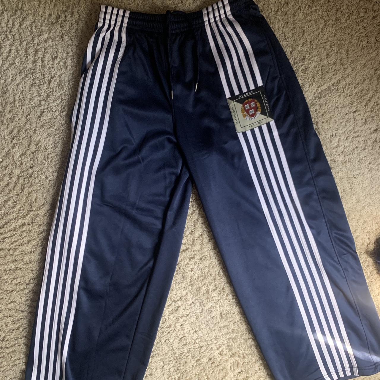 ALLURE COUNTY BLUE “CREST” TRACKPANTS. Size XL.... - Depop