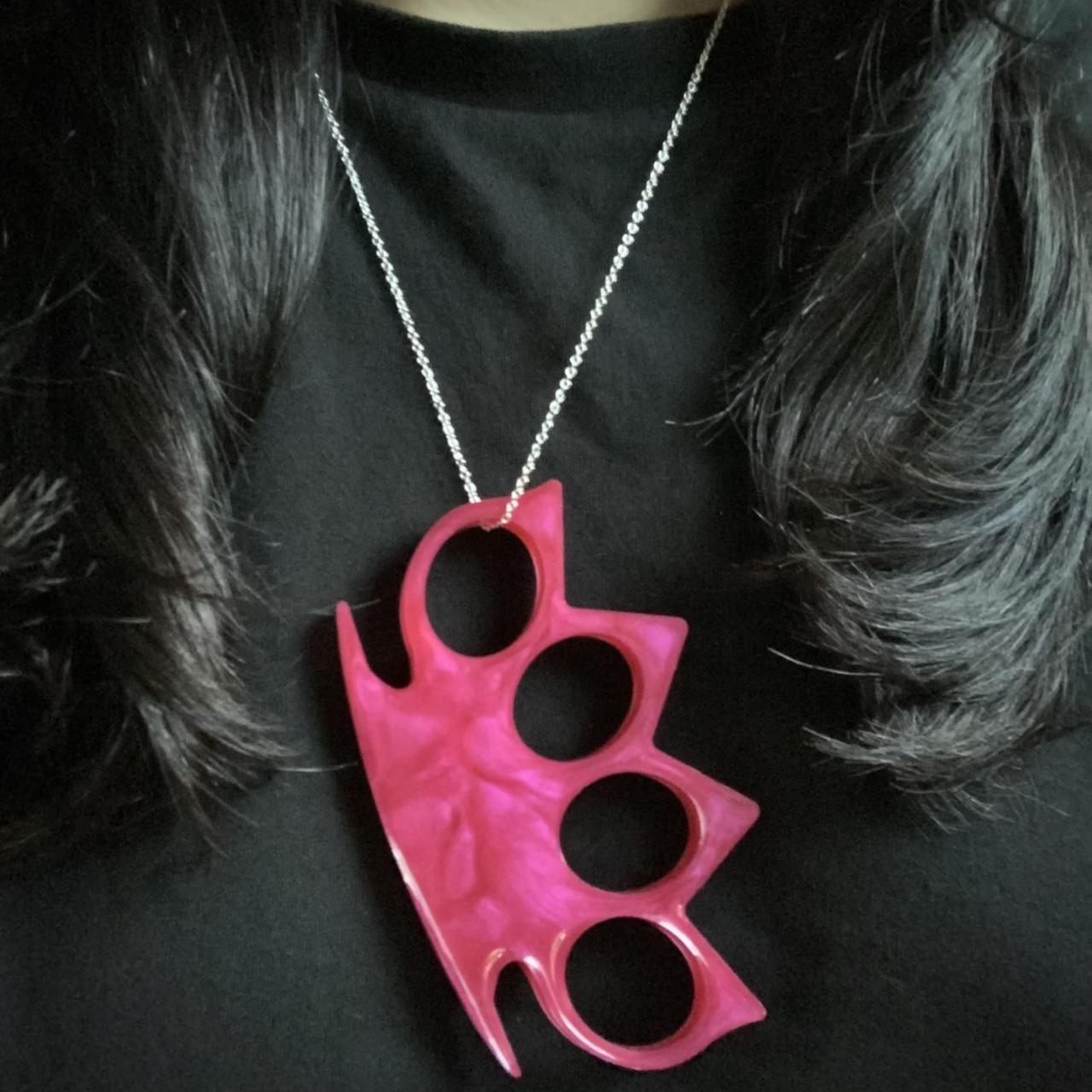 Pink knuckle duster necklace. - It’s an essential... - Depop