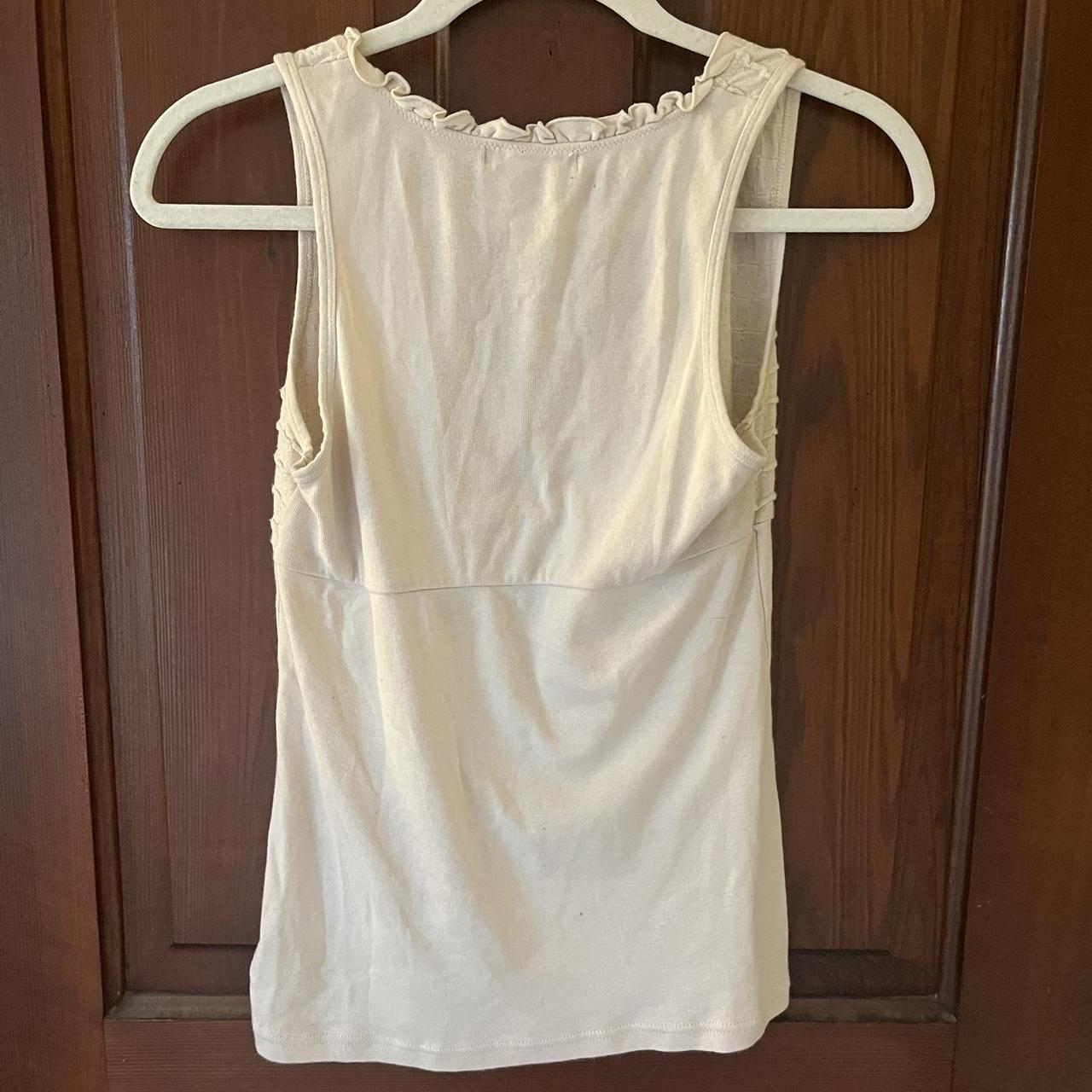cream tank super cute tank with little rose... - Depop