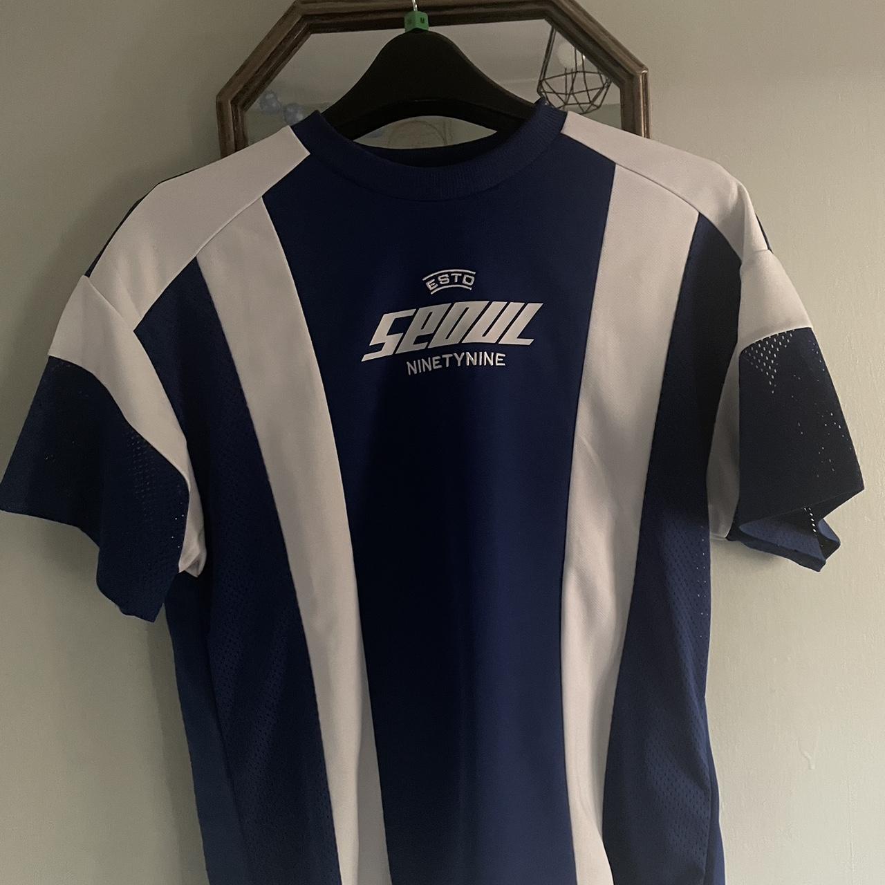 Blue and white t shirt Is a size xxs but fits a... - Depop