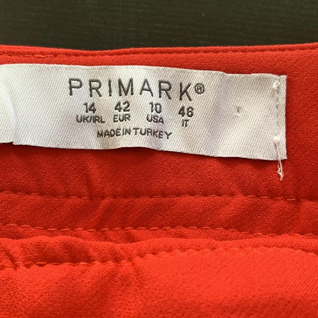 This is a bright red miniskirt with a false front... - Depop