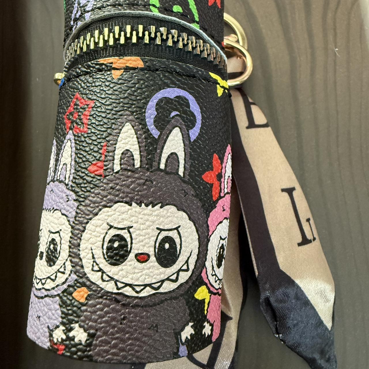 Black and multi-coloured cute Labubu lipstick case... | Depop