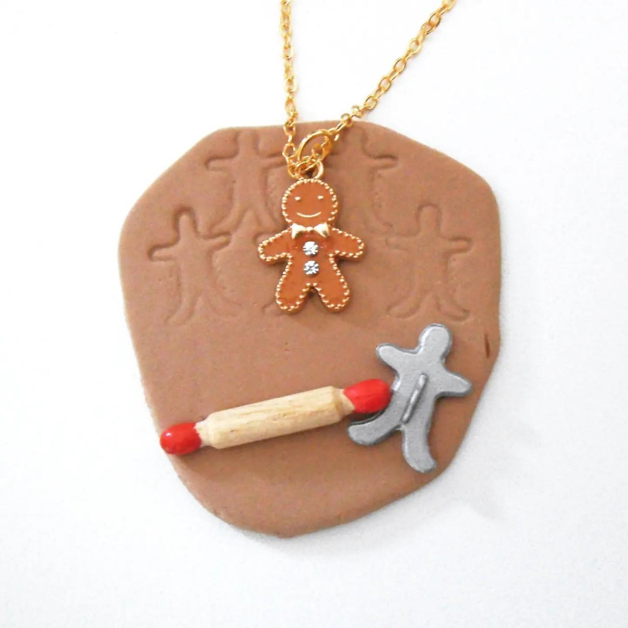 Gingerbread man necklace. Necklace is 18" and gold... - Depop