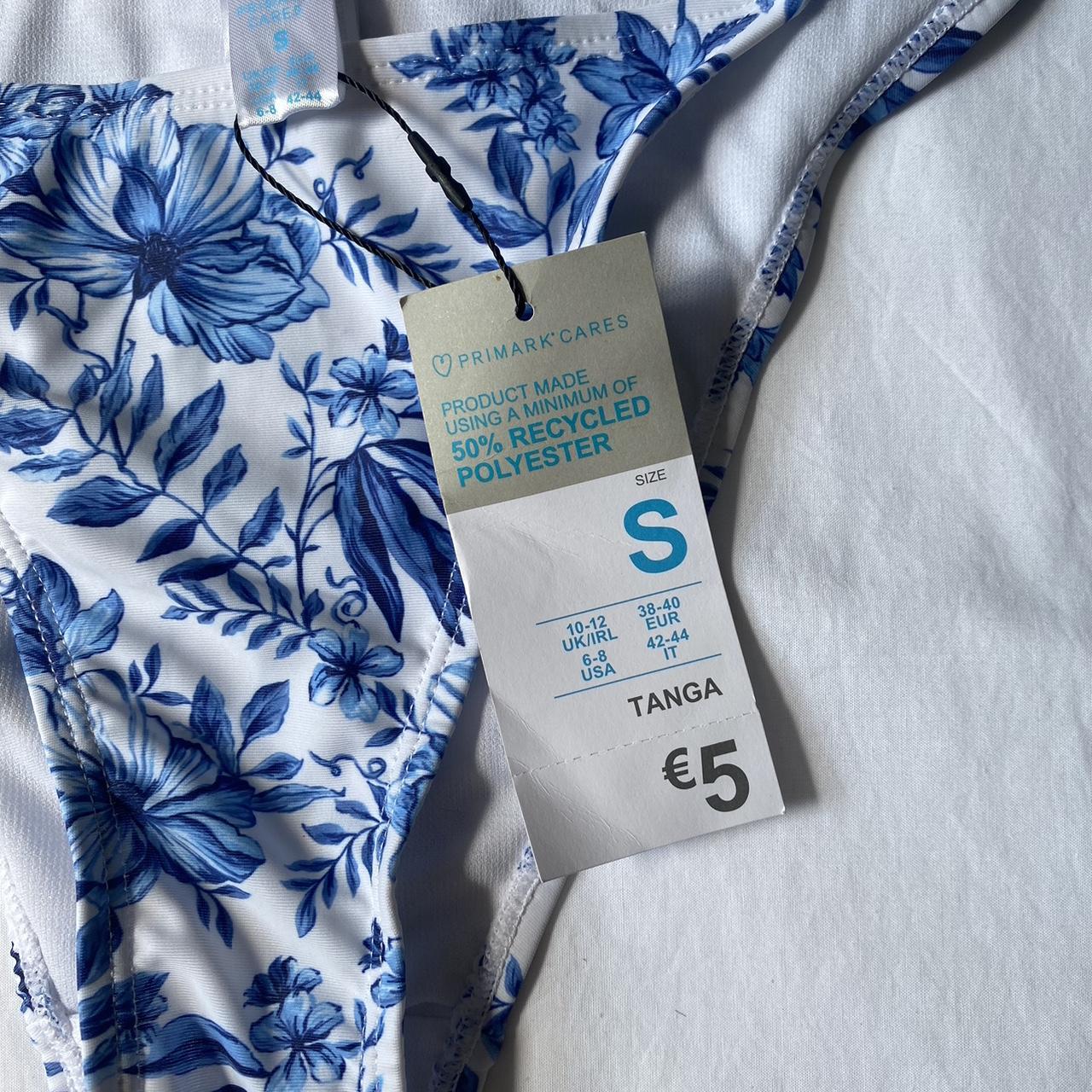 dark blue bikini top and blue and white floral... - Depop