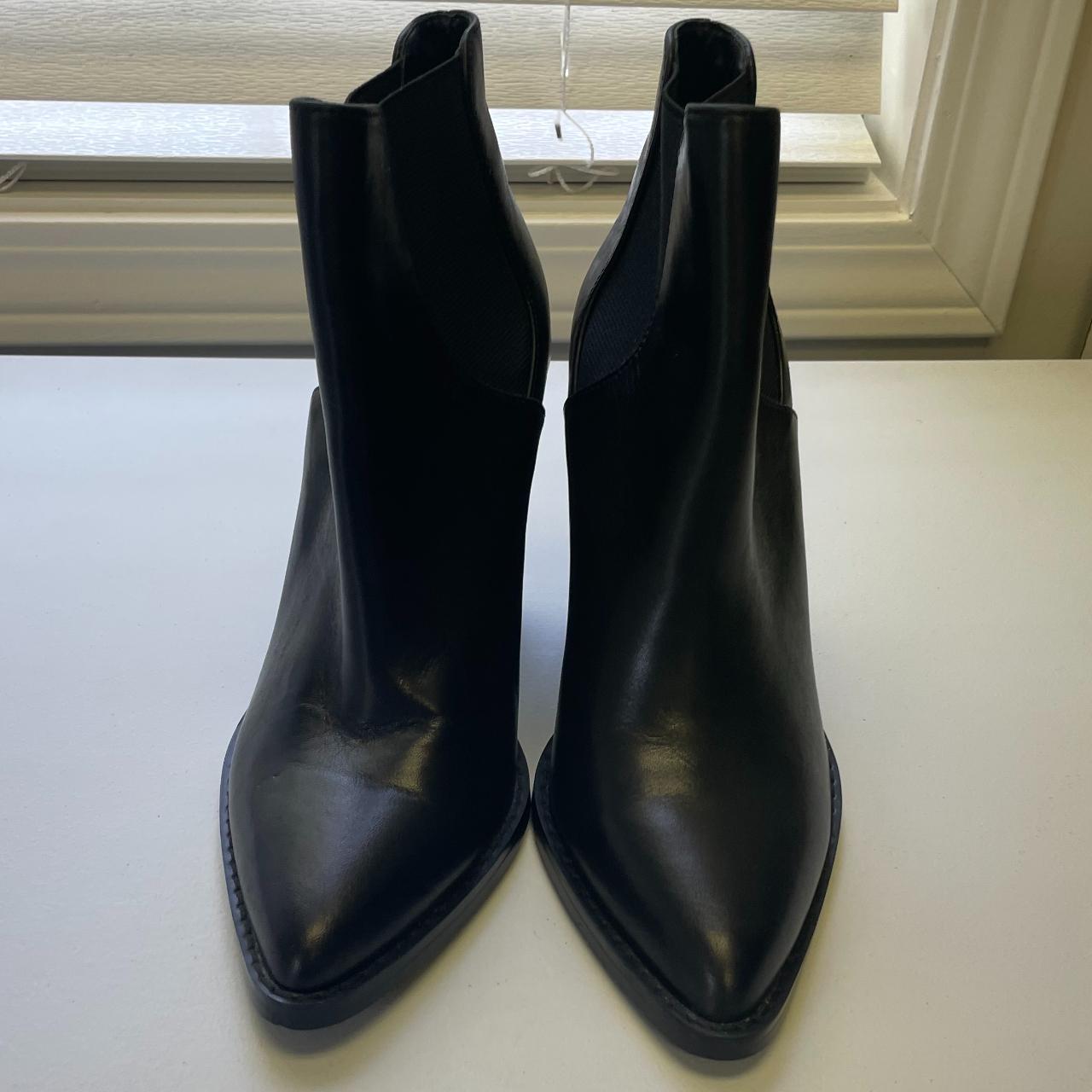 These booties feature a sleek and minimalist design,... - Depop