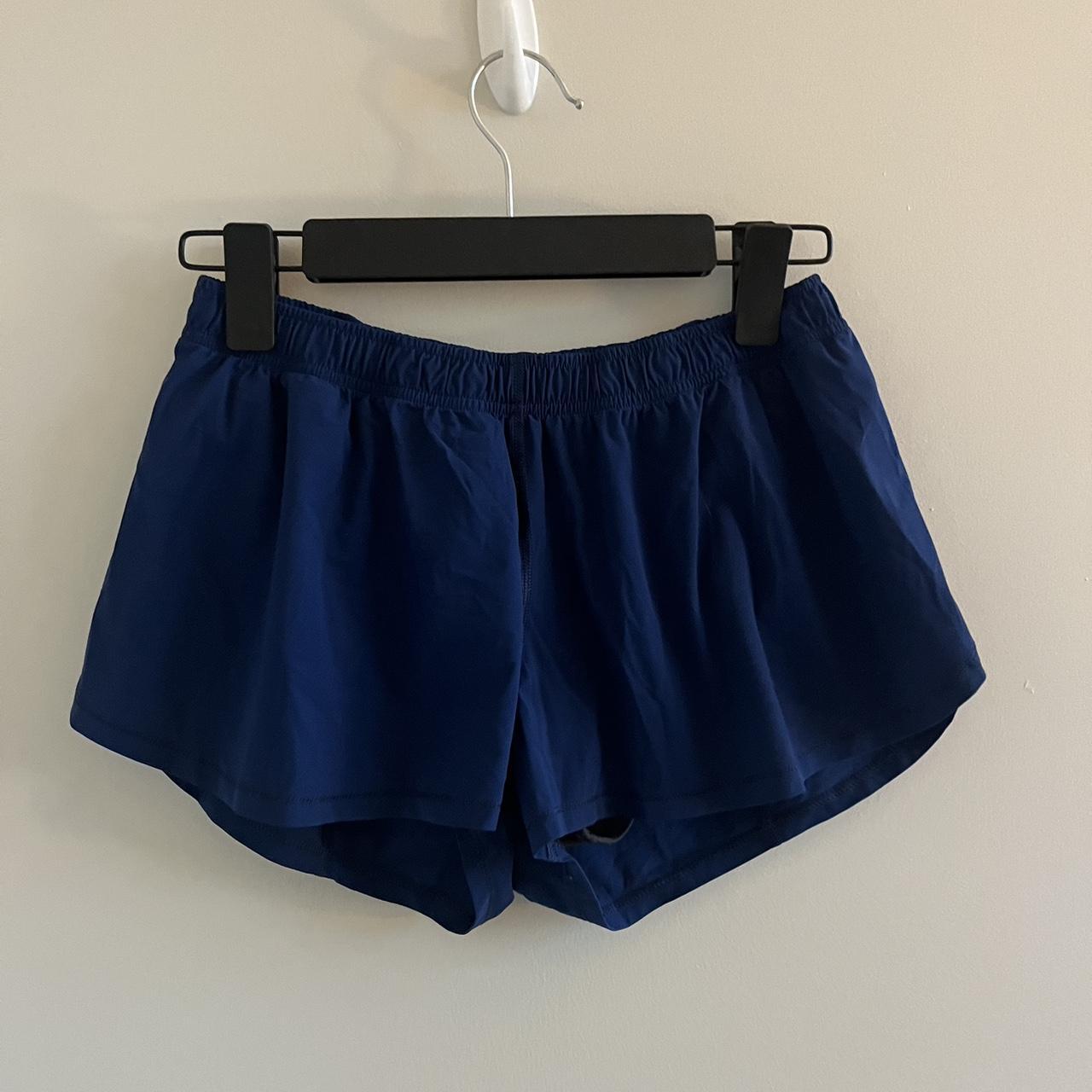 Blue runners shorts, formally a size medium but fits... - Depop