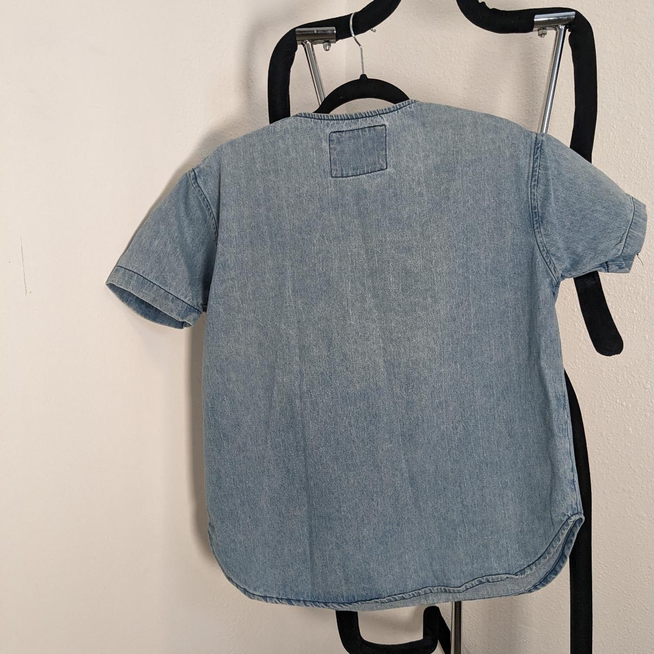 69 US denim tee size XS-S. Some cracking on the... - Depop