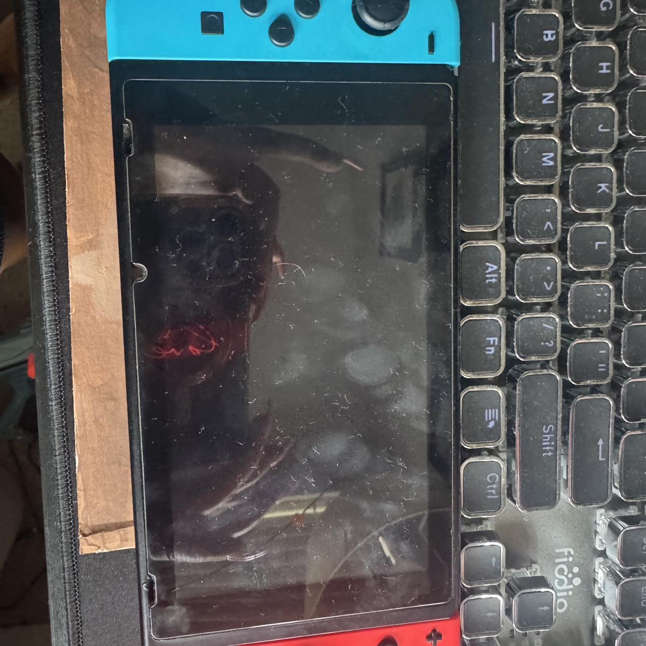 Nintendo Switch V1 with red and blue controllers: It... | Depop