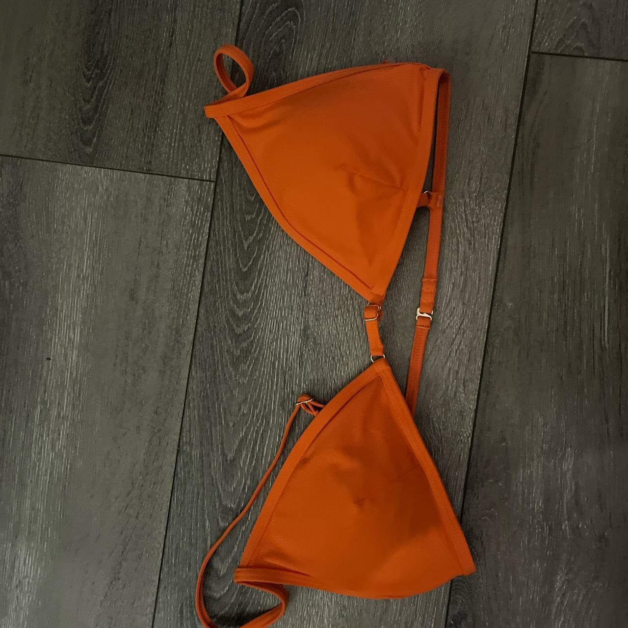 Orange garage bathing suit top. Runs small - Depop