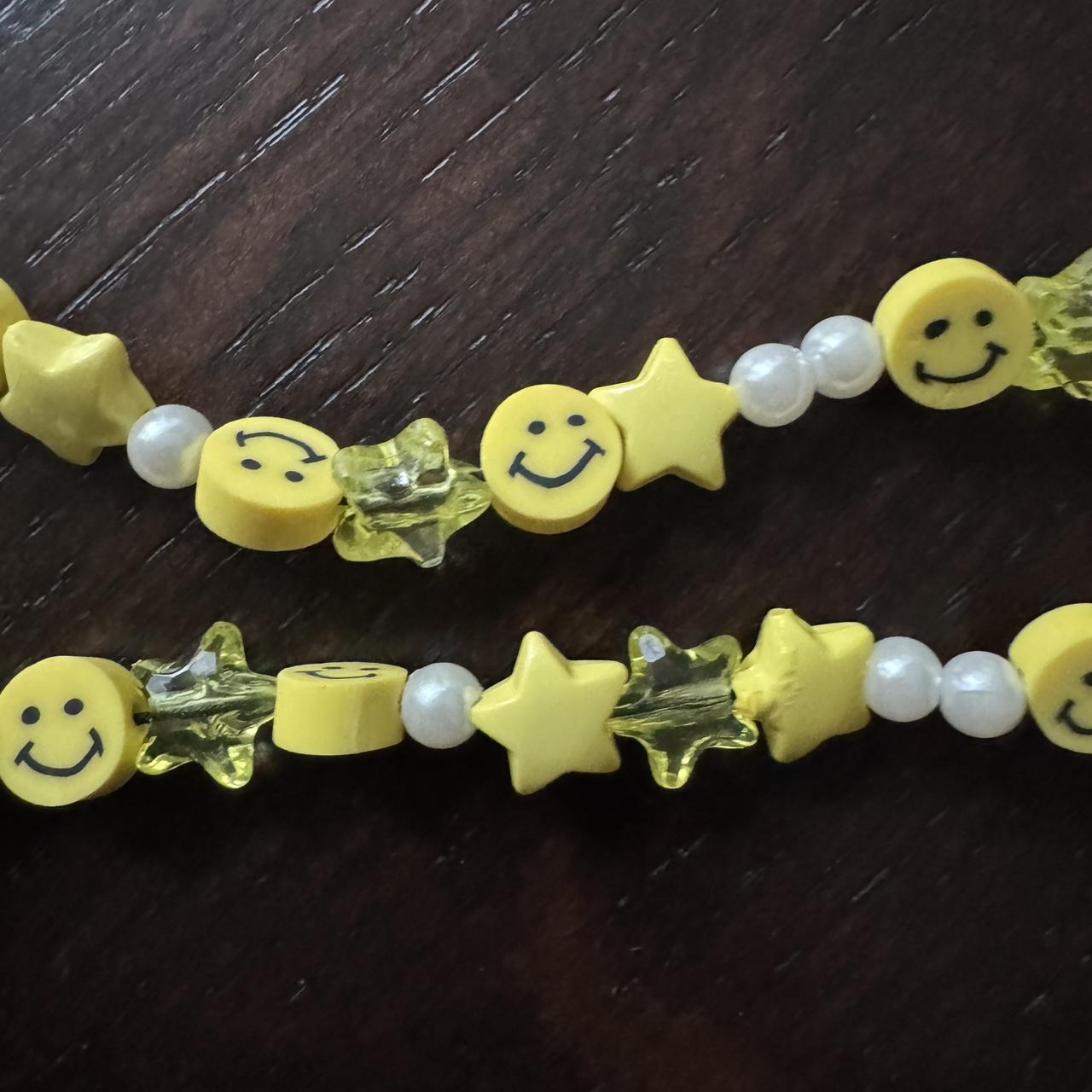 yellow smiley face, pearl, and star phone accessory... | Depop