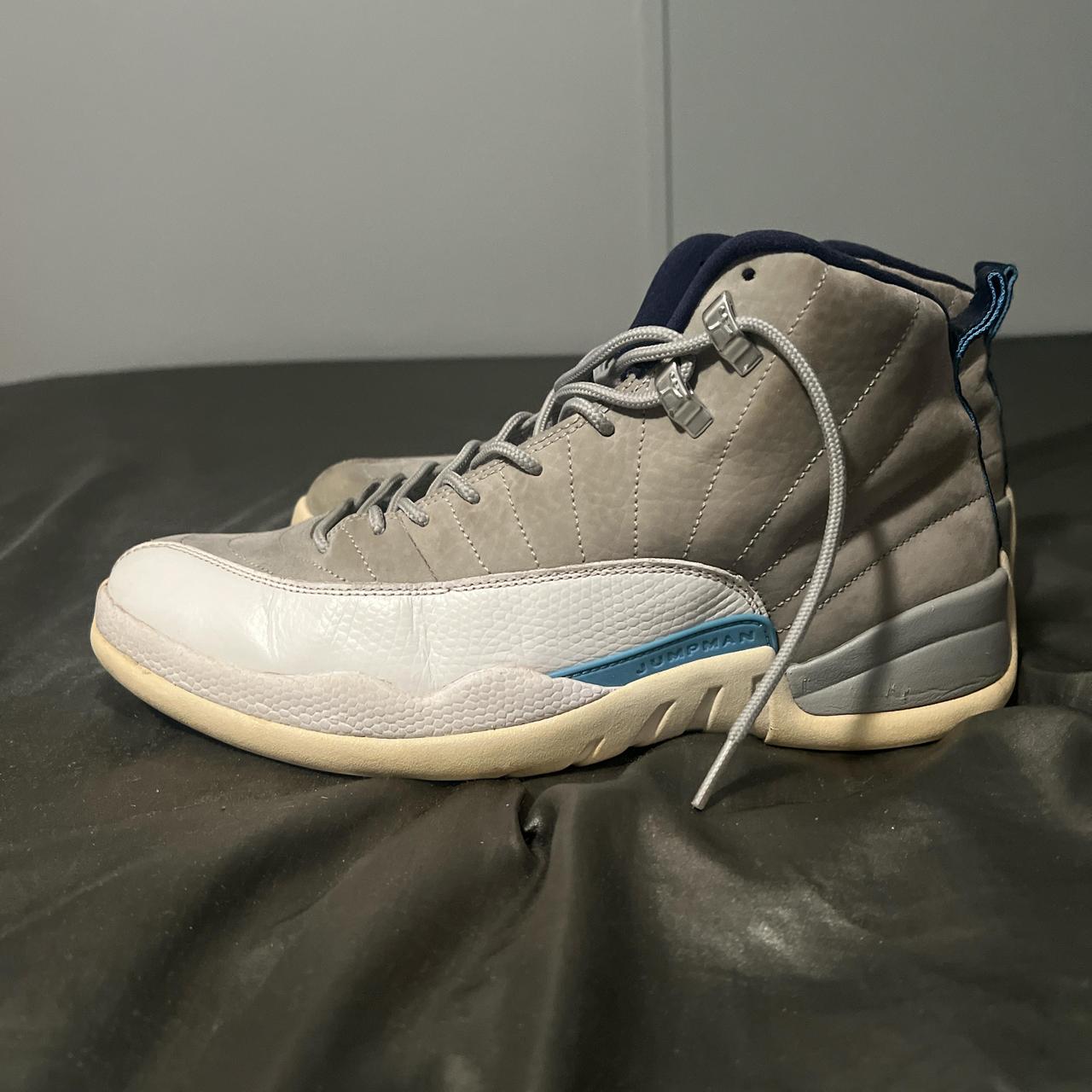 Jordan 12 grey university blue, worn and shows signs... - Depop