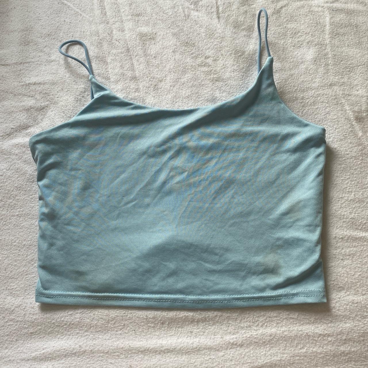 Light blue tank, material is kind of like dri fit.... - Depop