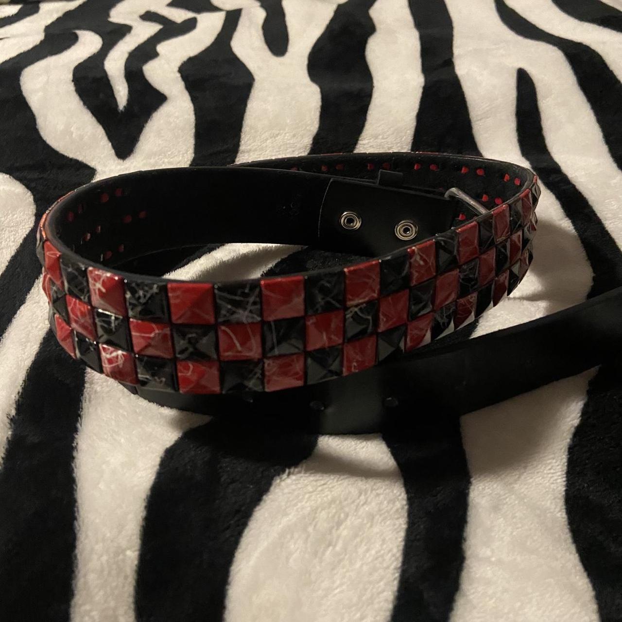 red & black checker studded belt around a small or... | Depop