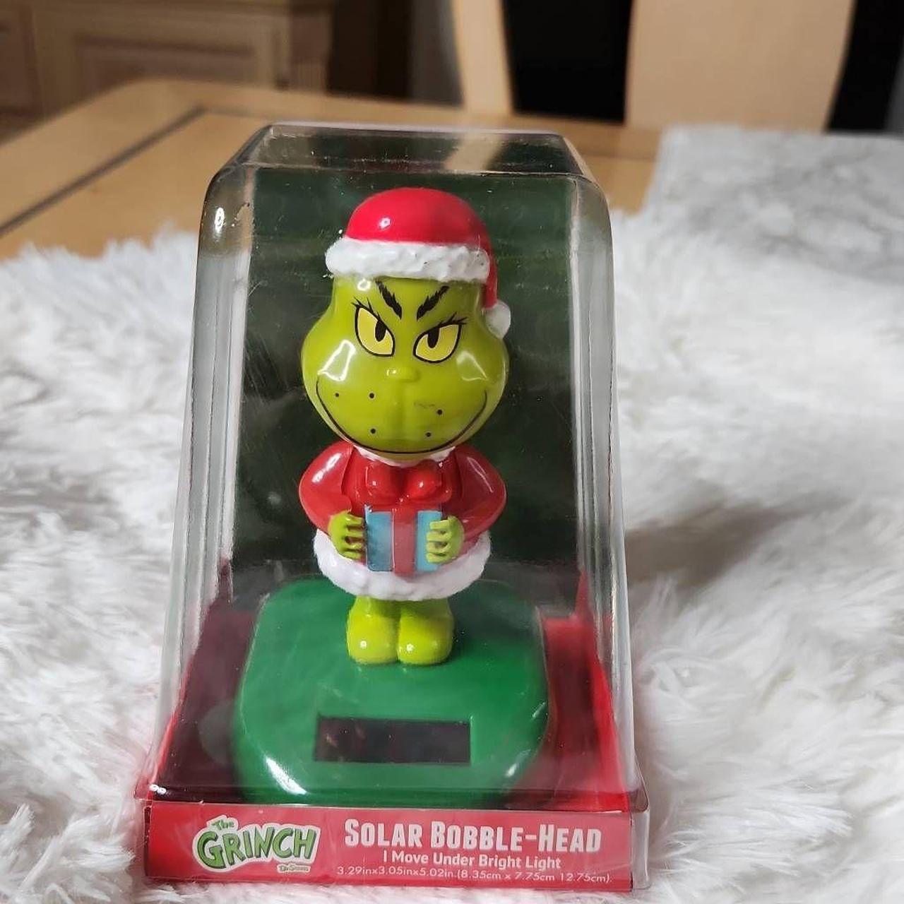 The Grinch Solar Christmas bobblehead I move under... - Depop