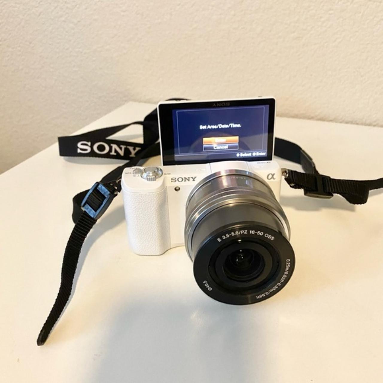 Sony a5100 white camera w different color lenses,... - Depop