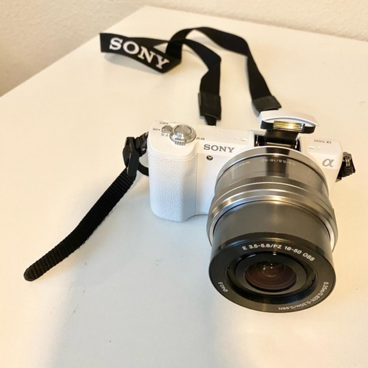 Sony a5100 white camera w different color lenses,... - Depop