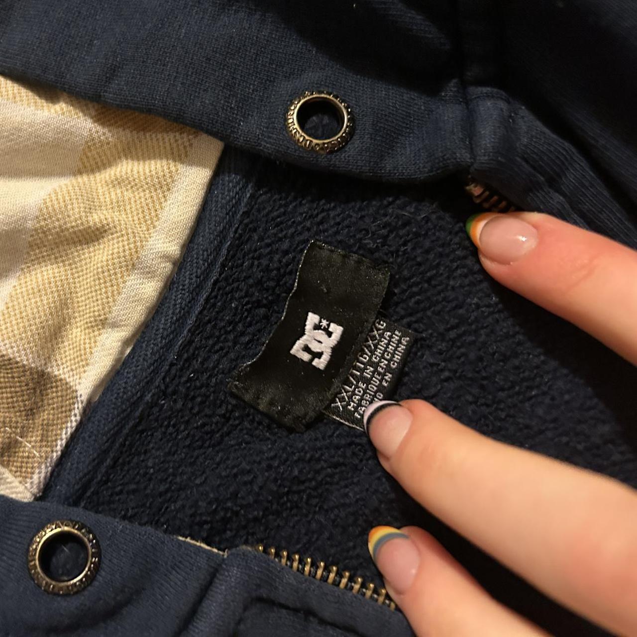 vintage navy zip-up DC with fun plaid design on the... | Depop