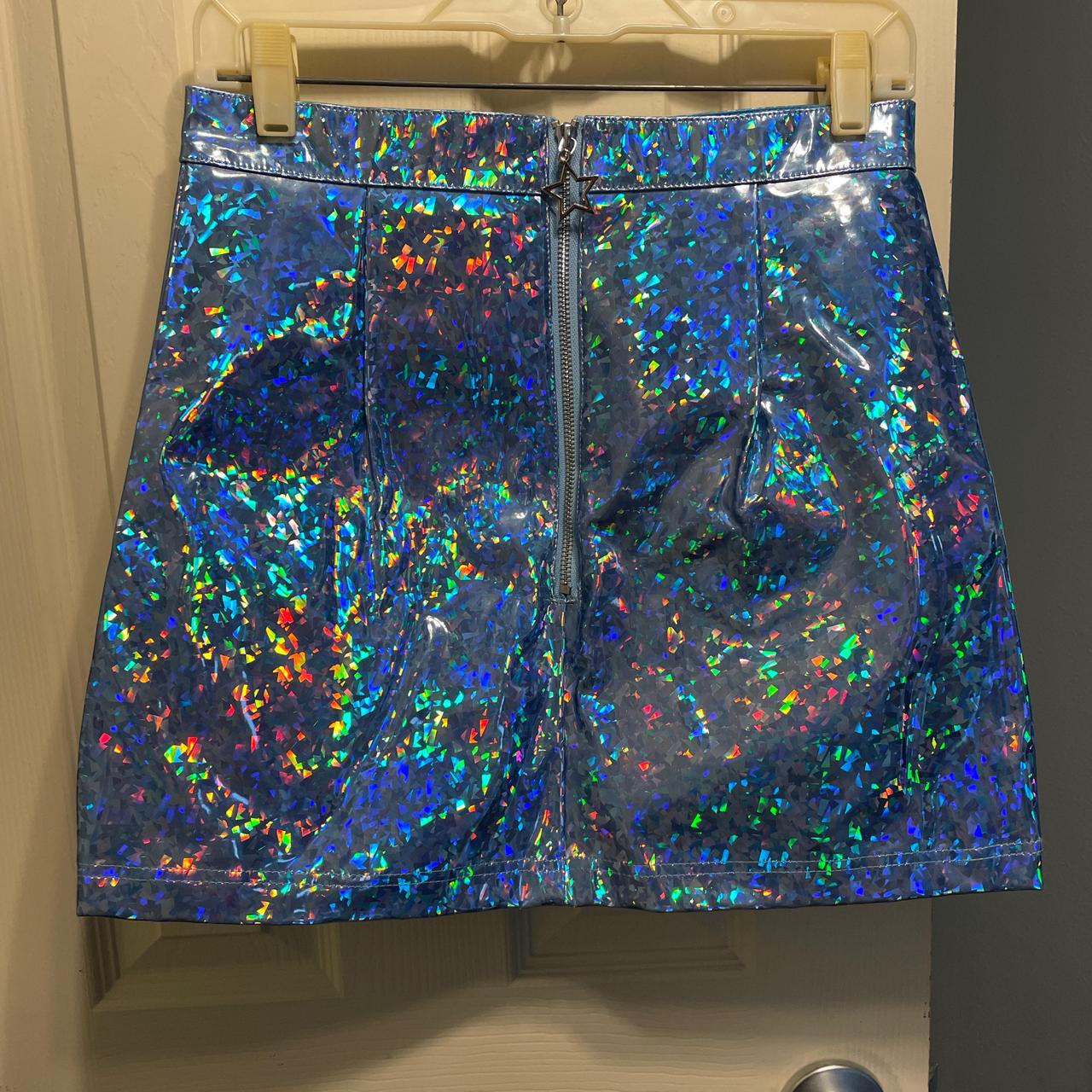 Holographic mini skirt with star shaped zipper... - Depop