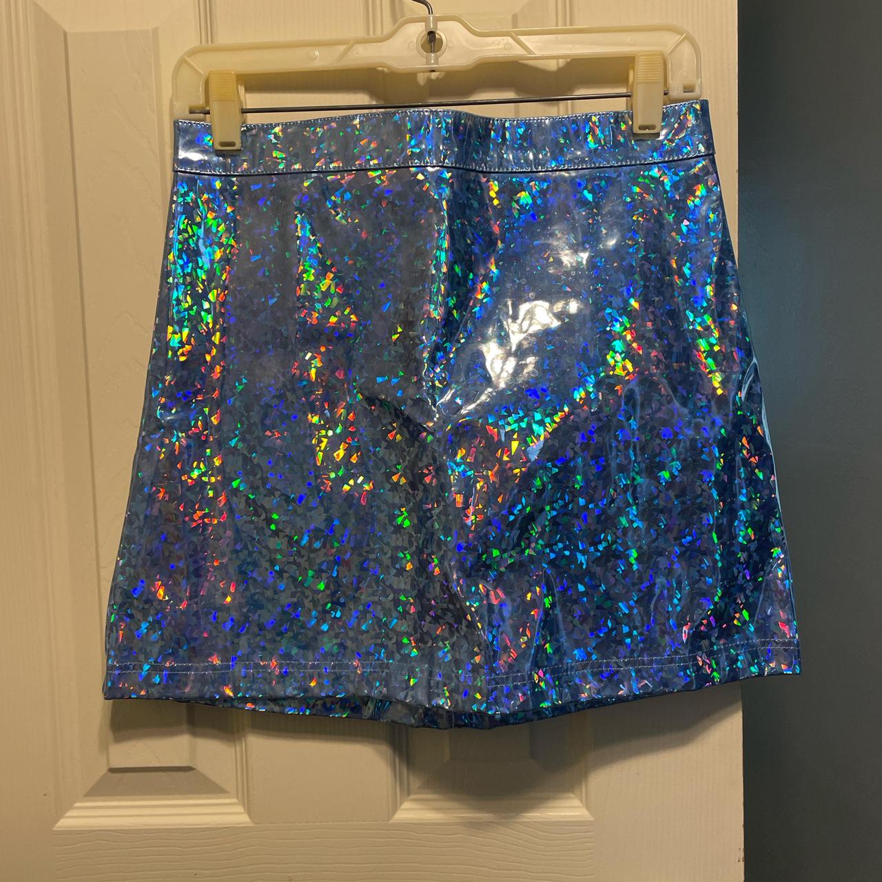 Holographic mini skirt with star shaped zipper... - Depop