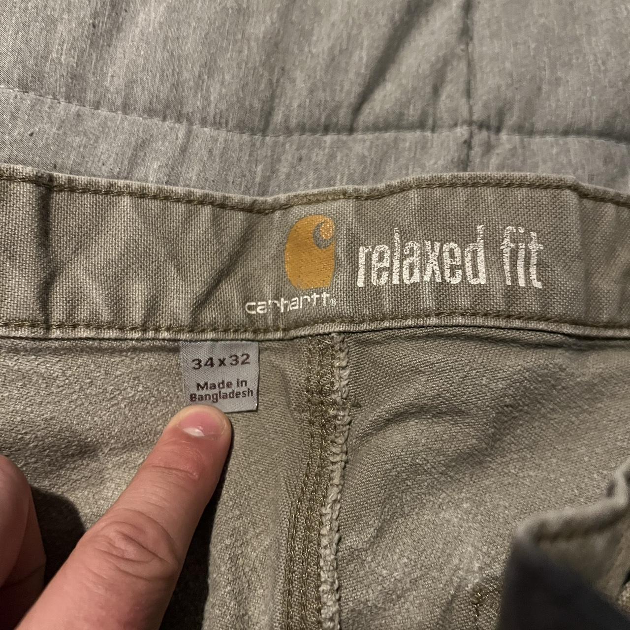 Carhartt relaxed fit 34x32 big hole on the knee and... - Depop