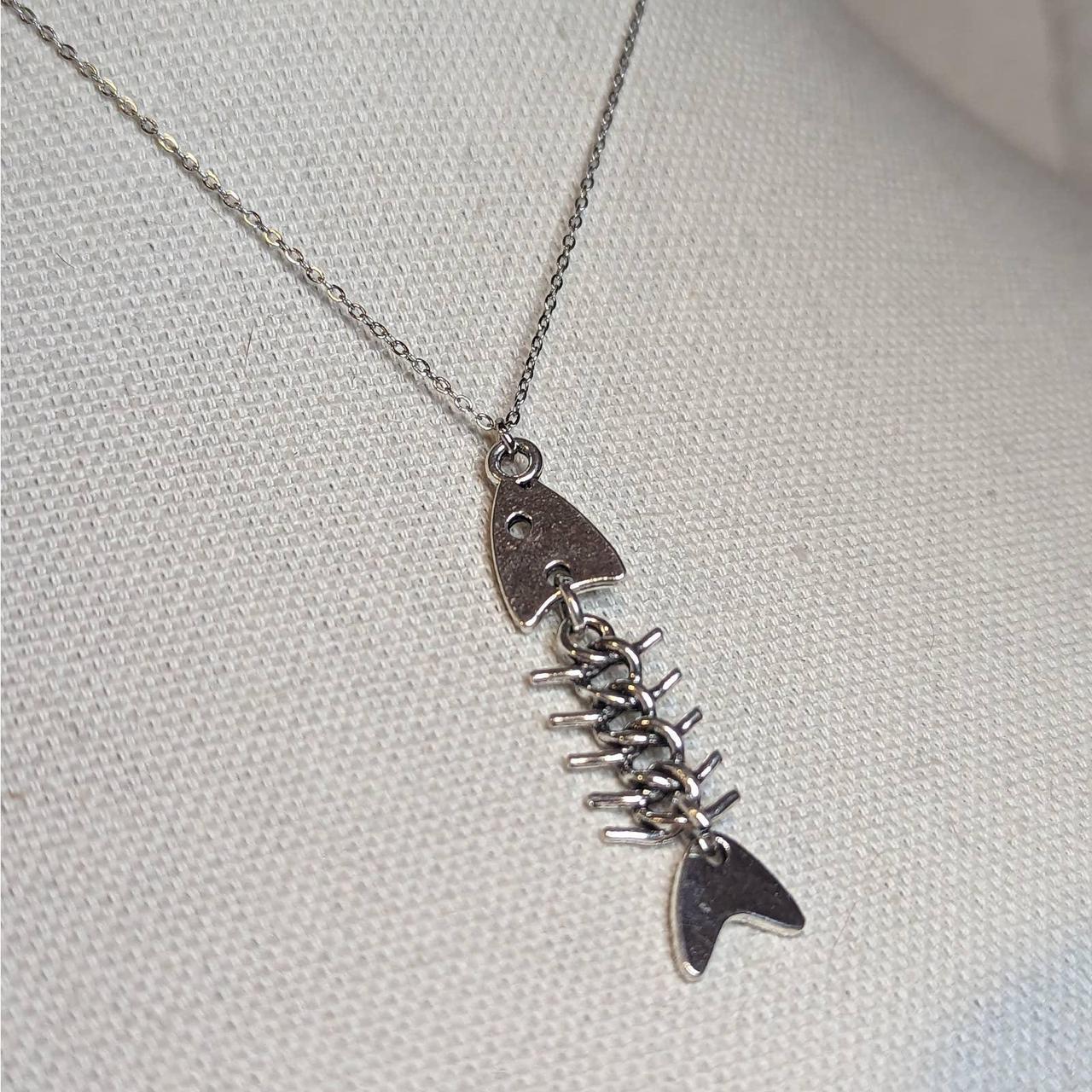 Fish Skeleton / Fish Bone Charm Necklace. Measures... - Depop