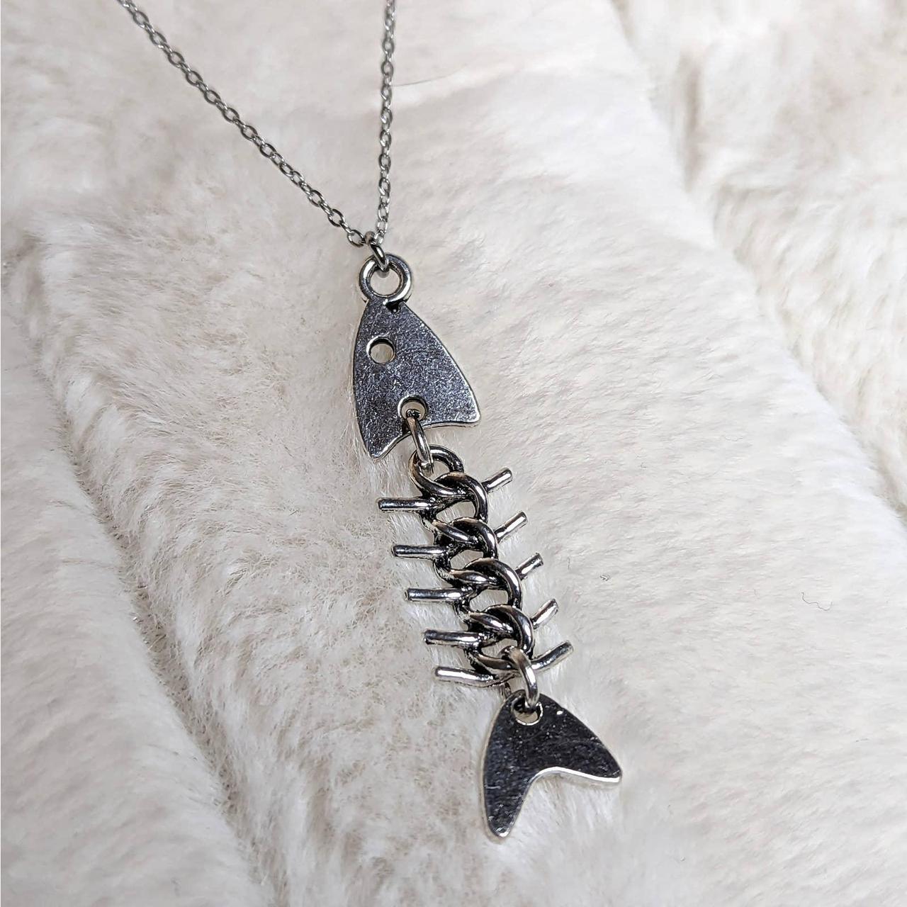 Fish Skeleton / Fish Bone Charm Necklace. Measures... - Depop