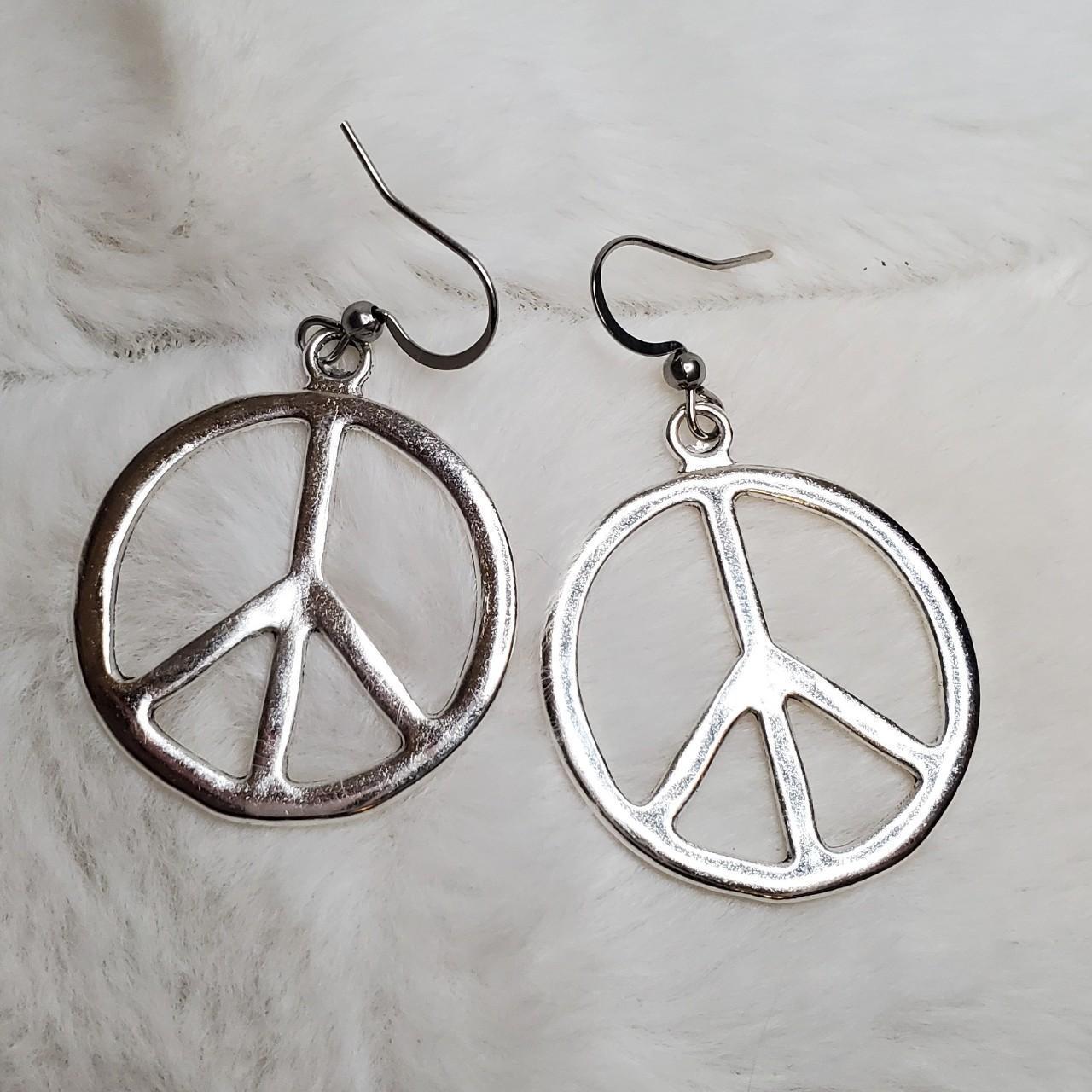 Large vintage style peace sign charm earrings.... - Depop