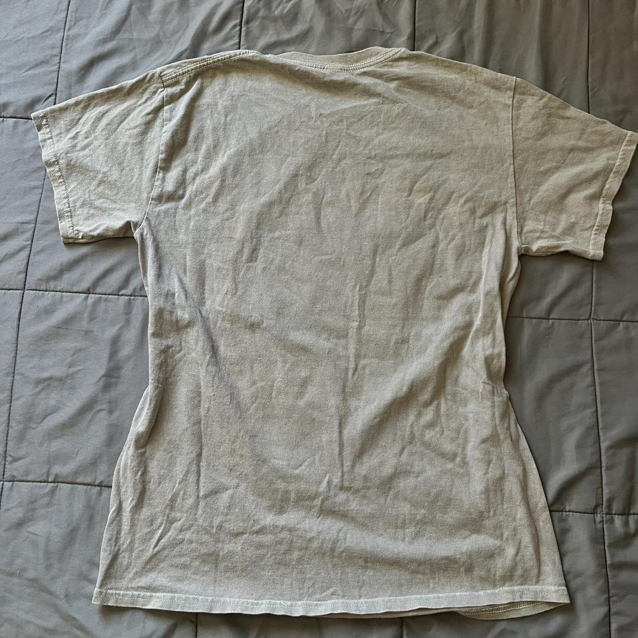 Tan Outkast graphic tee - faint stain on the back | Depop