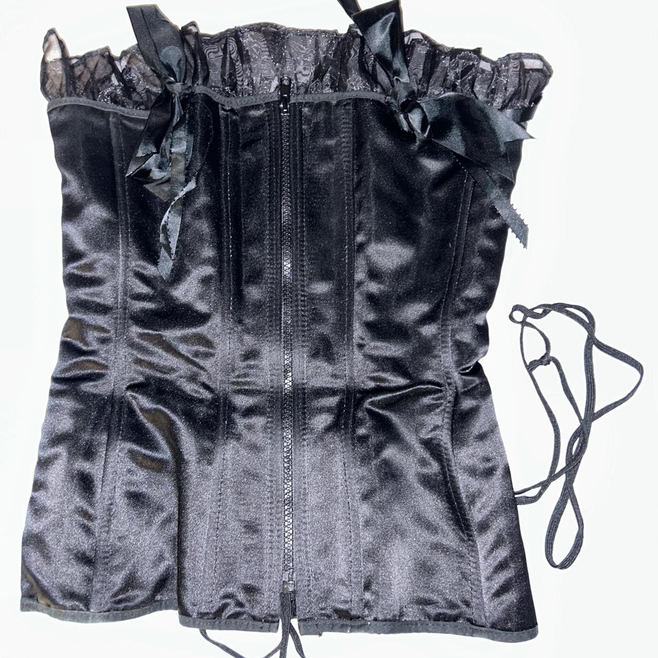 Black corset with a front zipper and bow detailing... - Depop