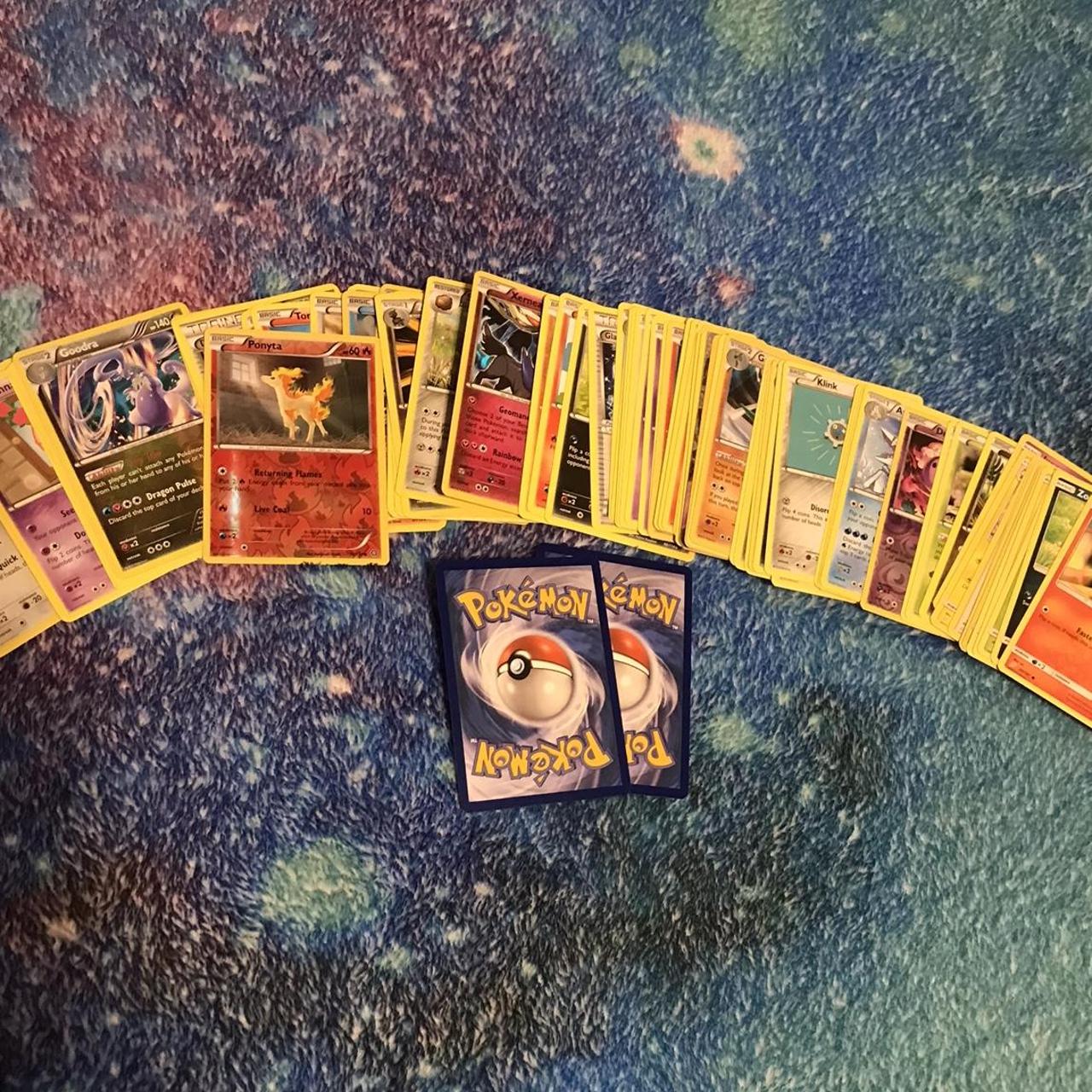 a whole bunch of pokémon cards, comes with the clear... - Depop