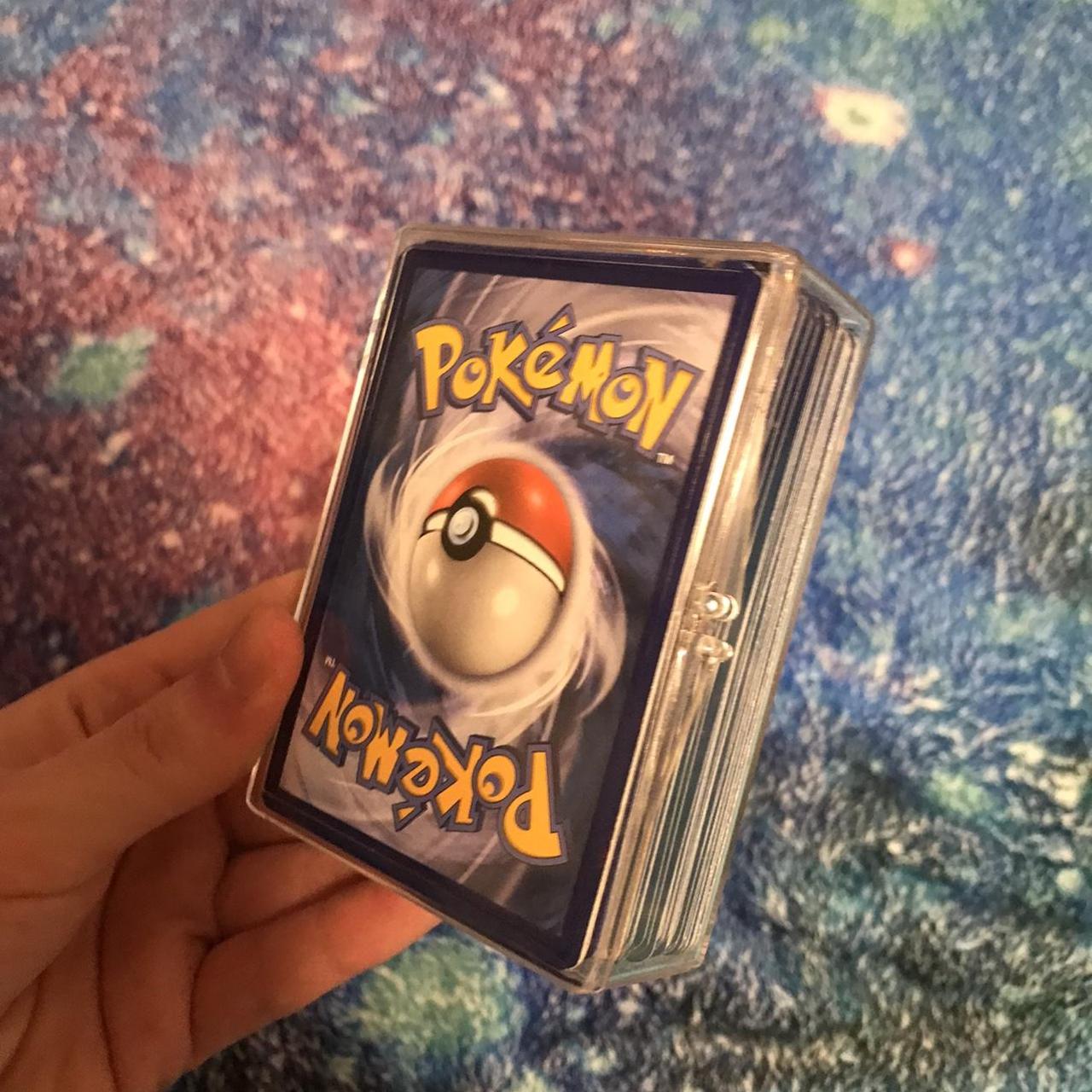a whole bunch of pokémon cards, comes with the clear... - Depop