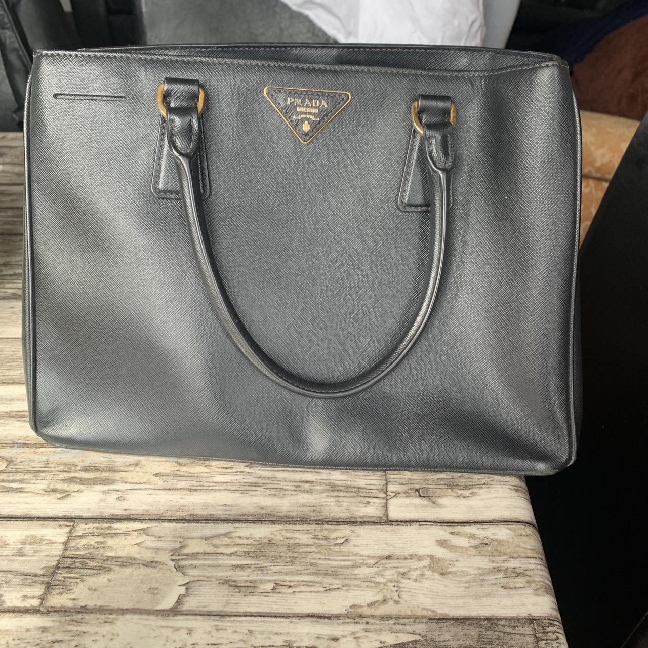 Black and gold second hand Prada handbag in great... - Depop