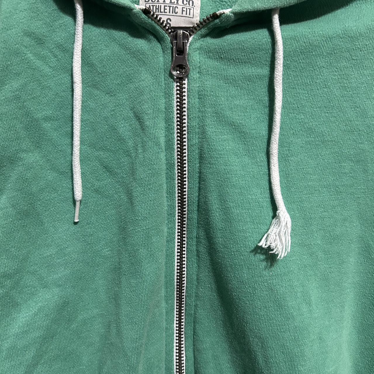 cute green zip up jacket only noticeable flaw is... - Depop